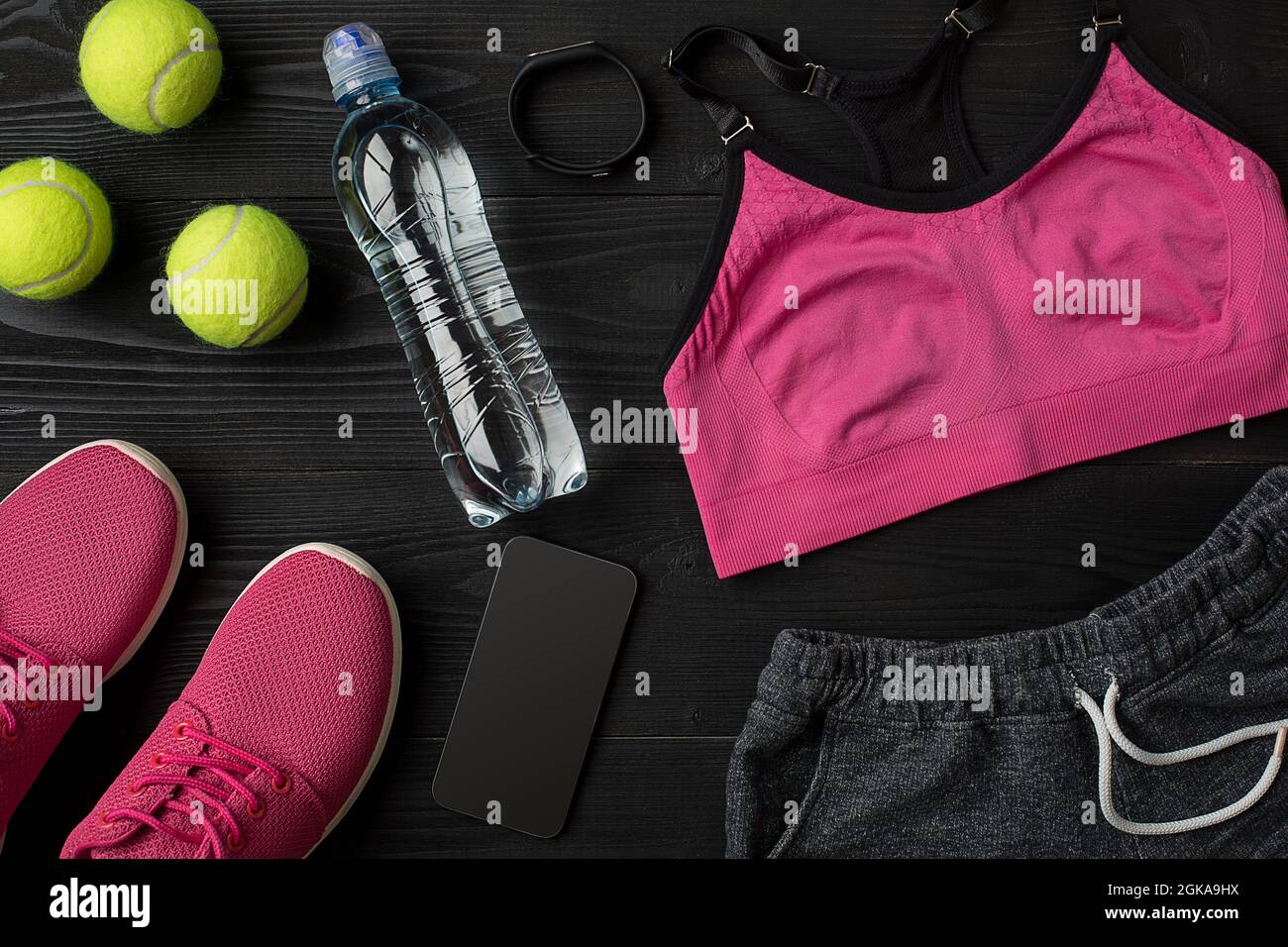 Workout plan with fitness food and equipment on dark background, top ...