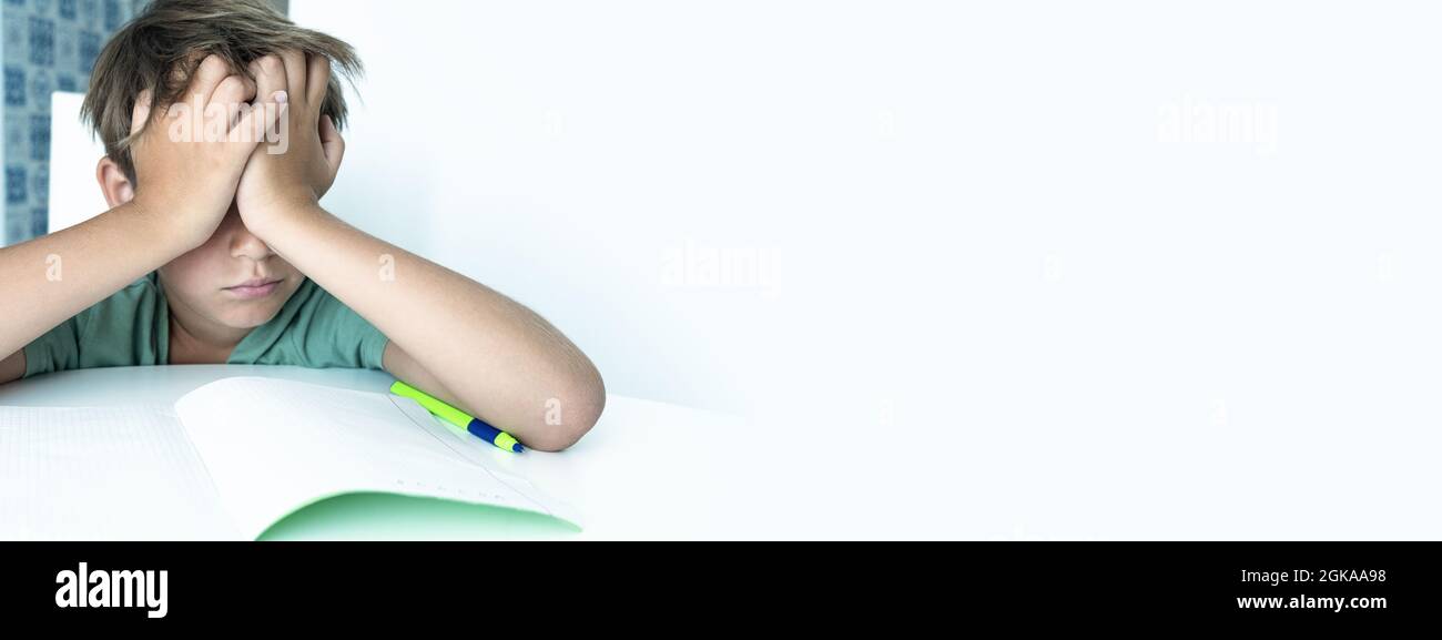 Banner. Sad boy with textbook does school homework. Back to school ...