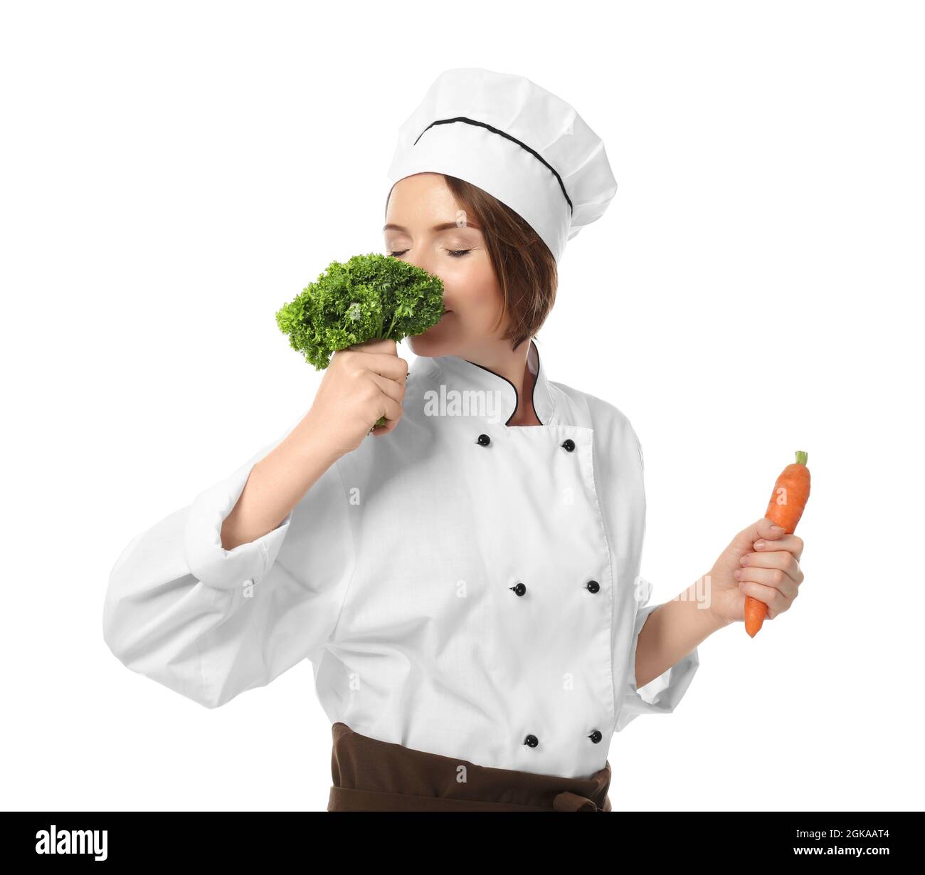 Female chef with vegetables on white background Stock Photo - Alamy