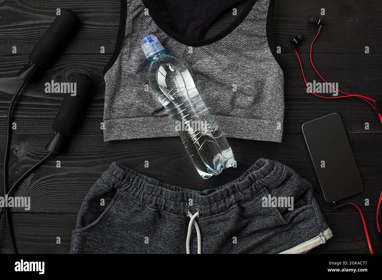 Workout plan with fitness food and equipment on dark background, top ...