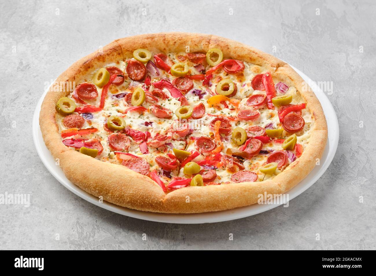 Small size pizza with thin sausage, bell pepper, olives and onion Stock ...