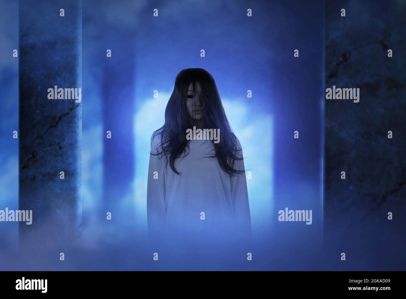 Scary ghost woman standing in the abandoned building. Halloween concept ...