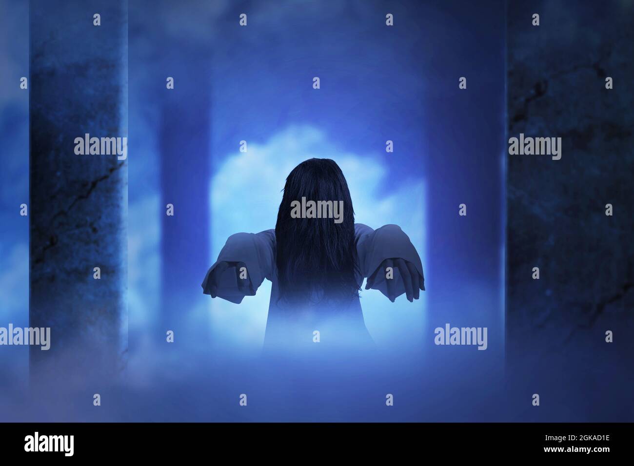 Scary ghost woman standing in the abandoned building. Halloween concept ...