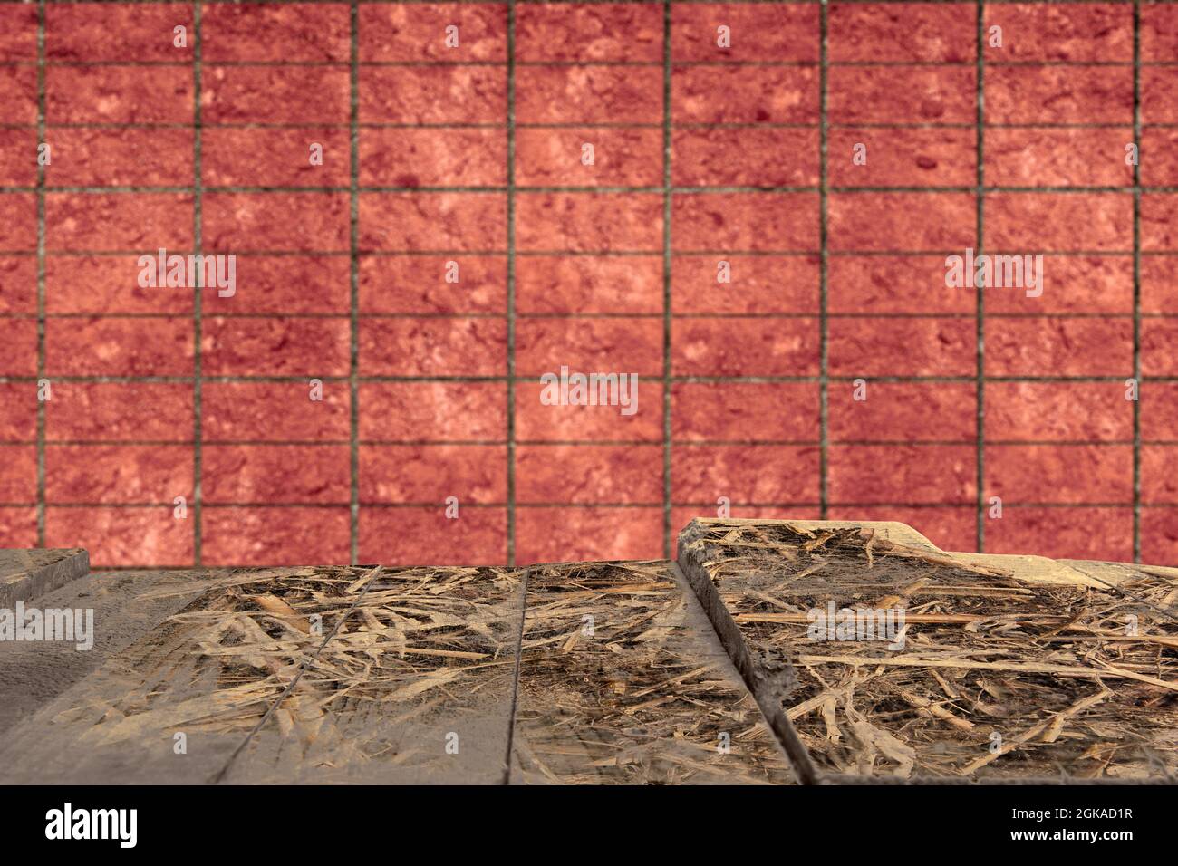 Wooden table with red brick wall background Stock Photo - Alamy