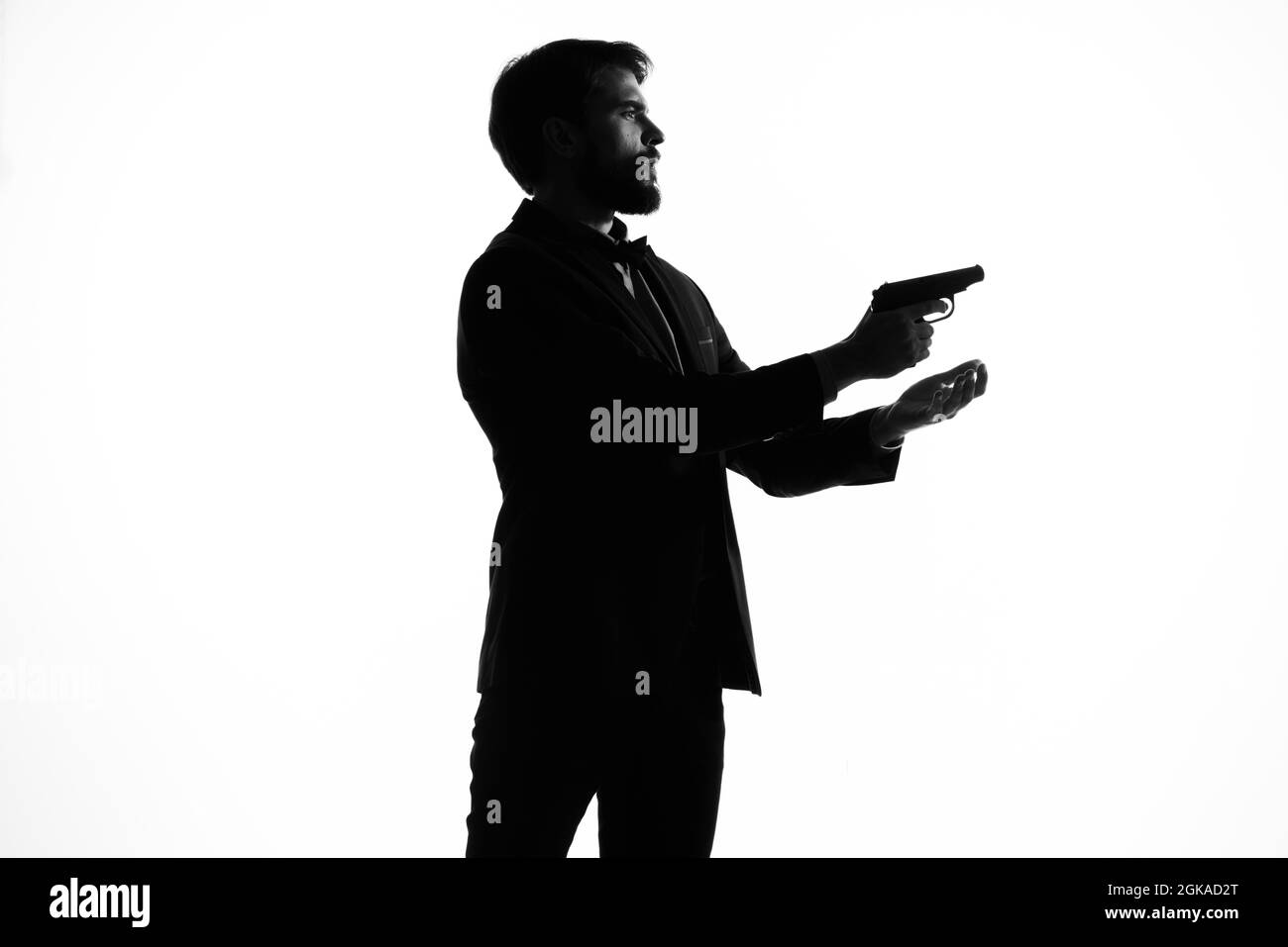 Man with a pistol in hand crime hand gesture isolated background Stock ...