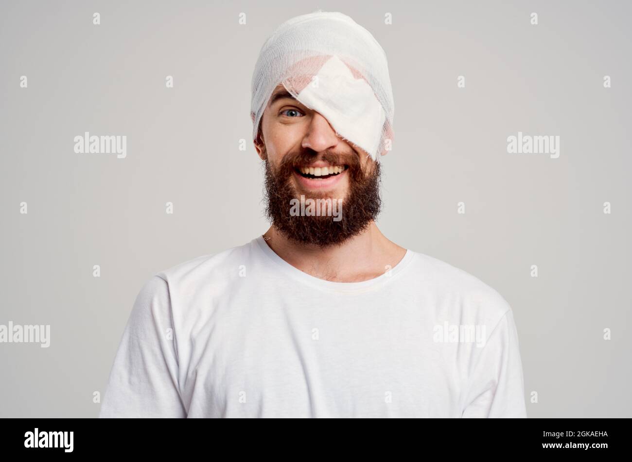 patient with a bandaged head and an eye blood isolated background Stock ...