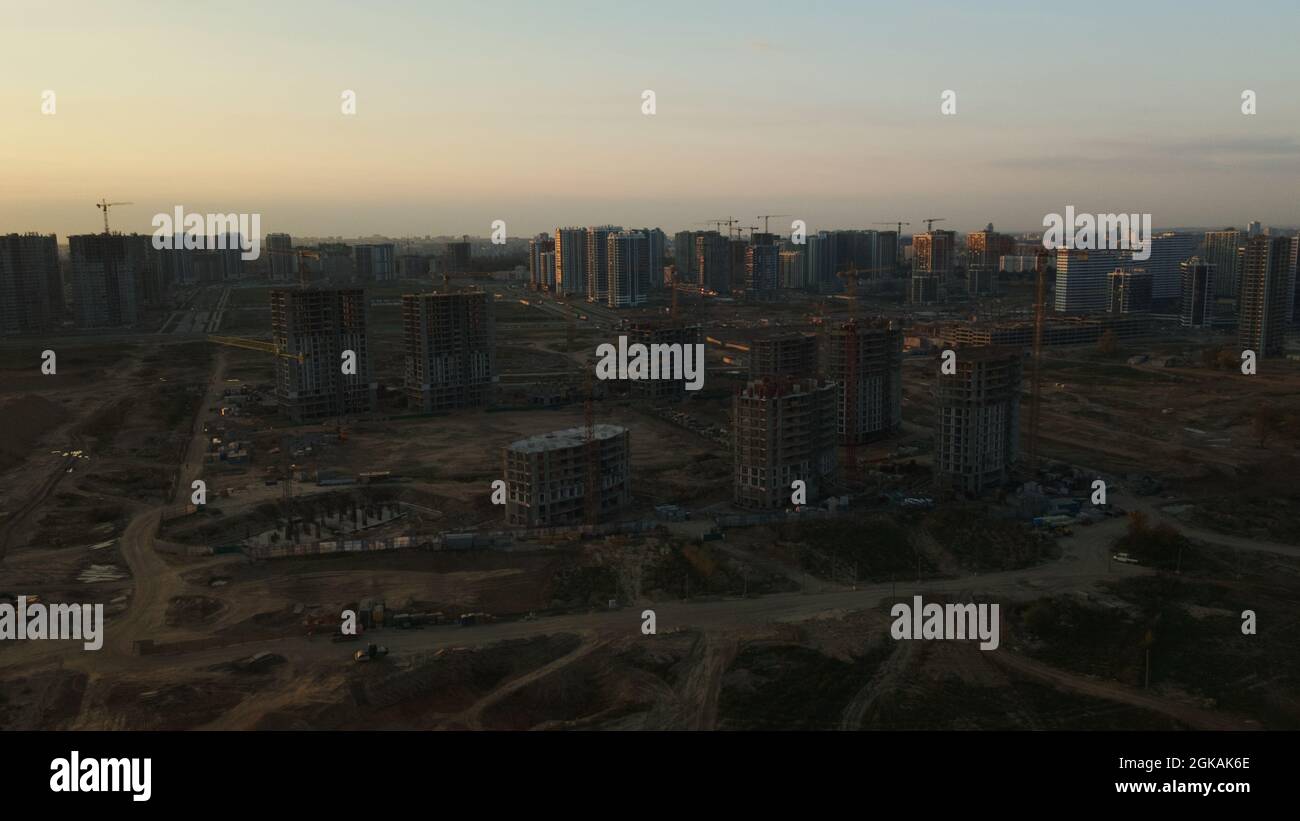 Construction site of a modern city block. High-rise buildings under ...