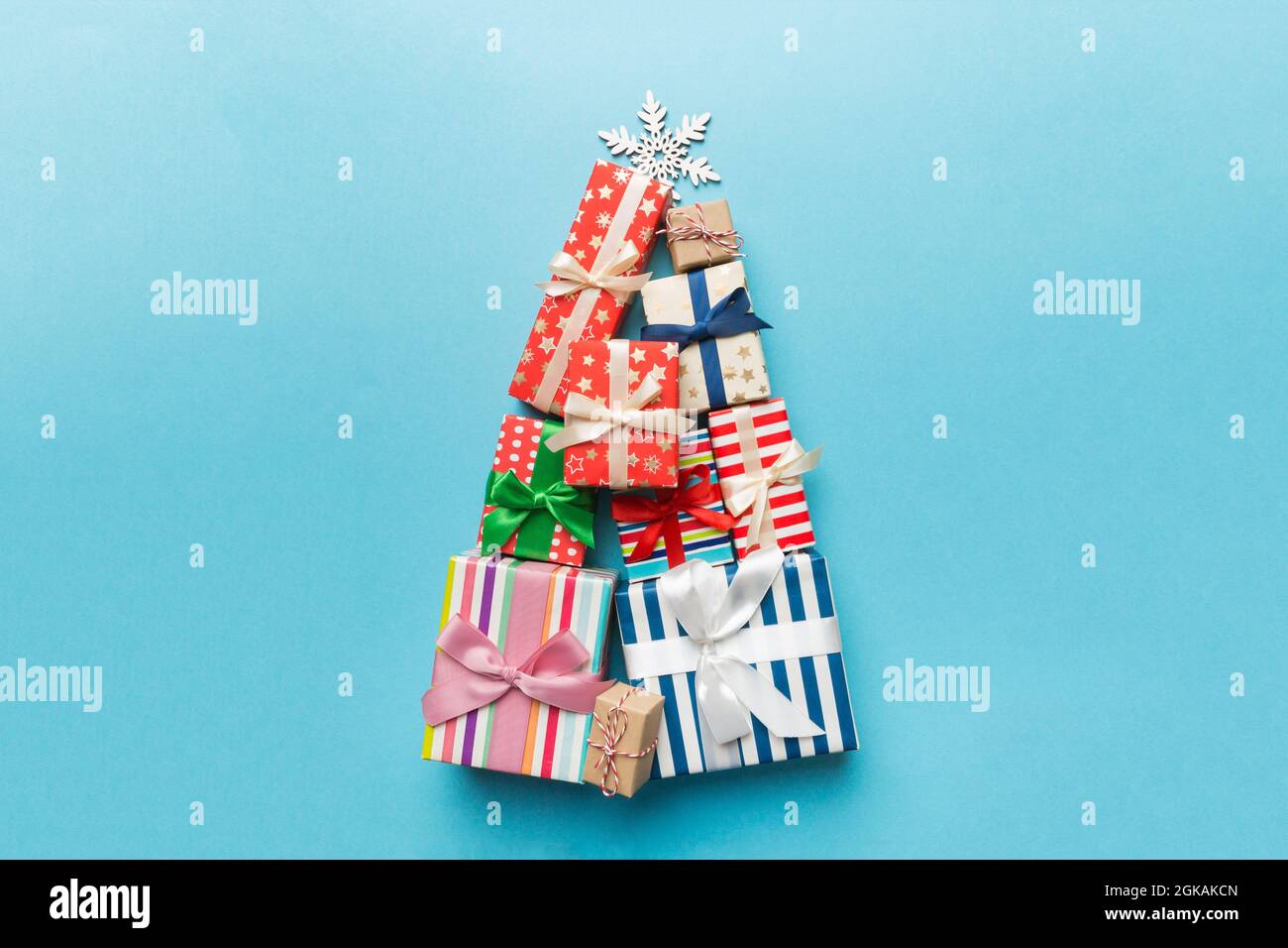 Christmas tree made of beautifuly wrapped presents on colored ...