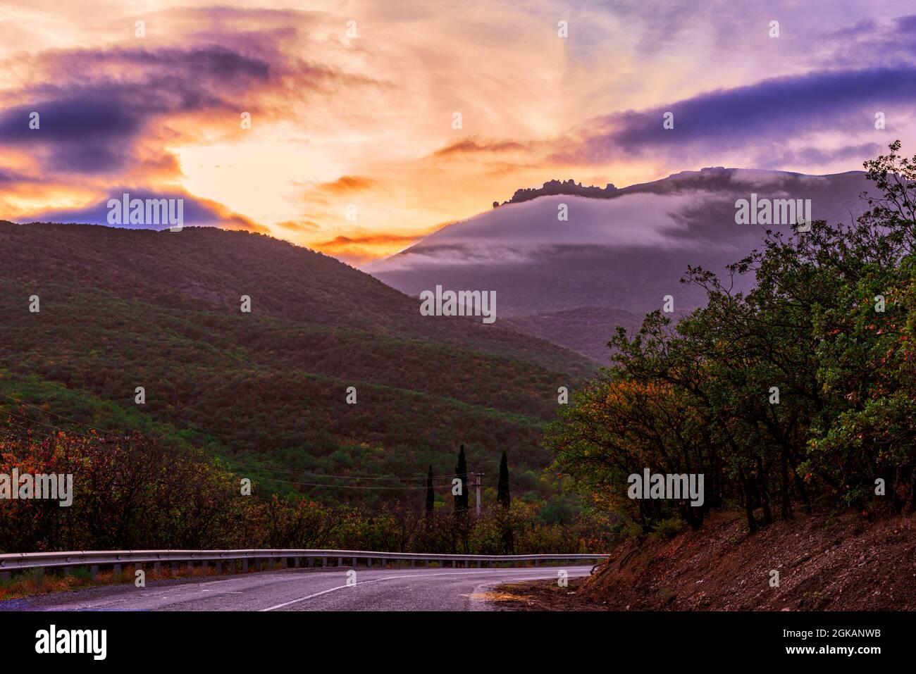 Mountain evening landscape with a bright dawn Stock Photo - Alamy