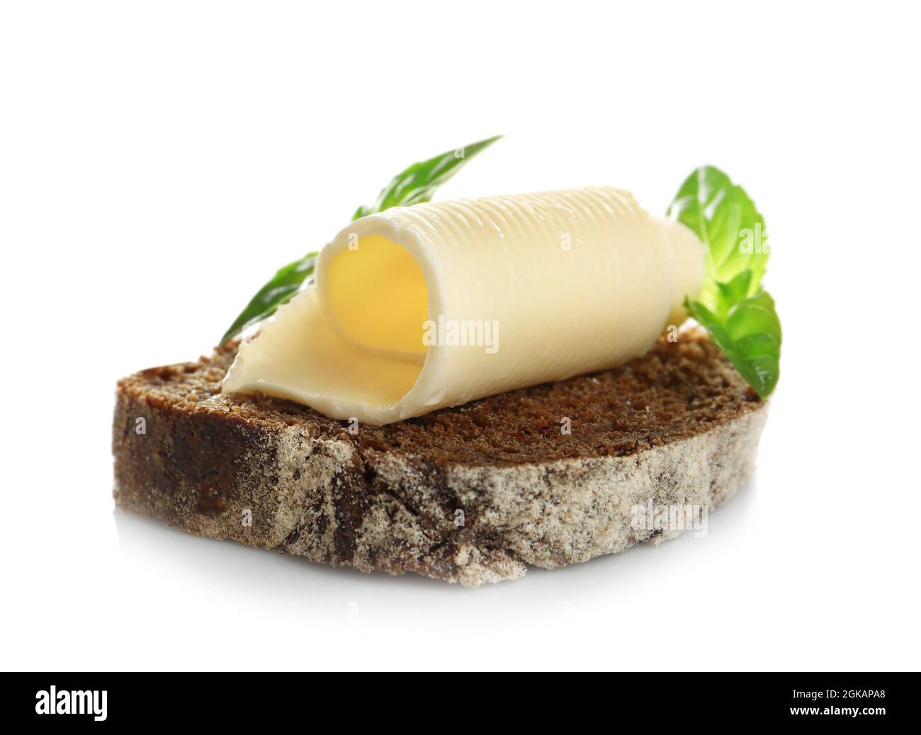 Slice of bread with butter curl on white background Stock Photo - Alamy