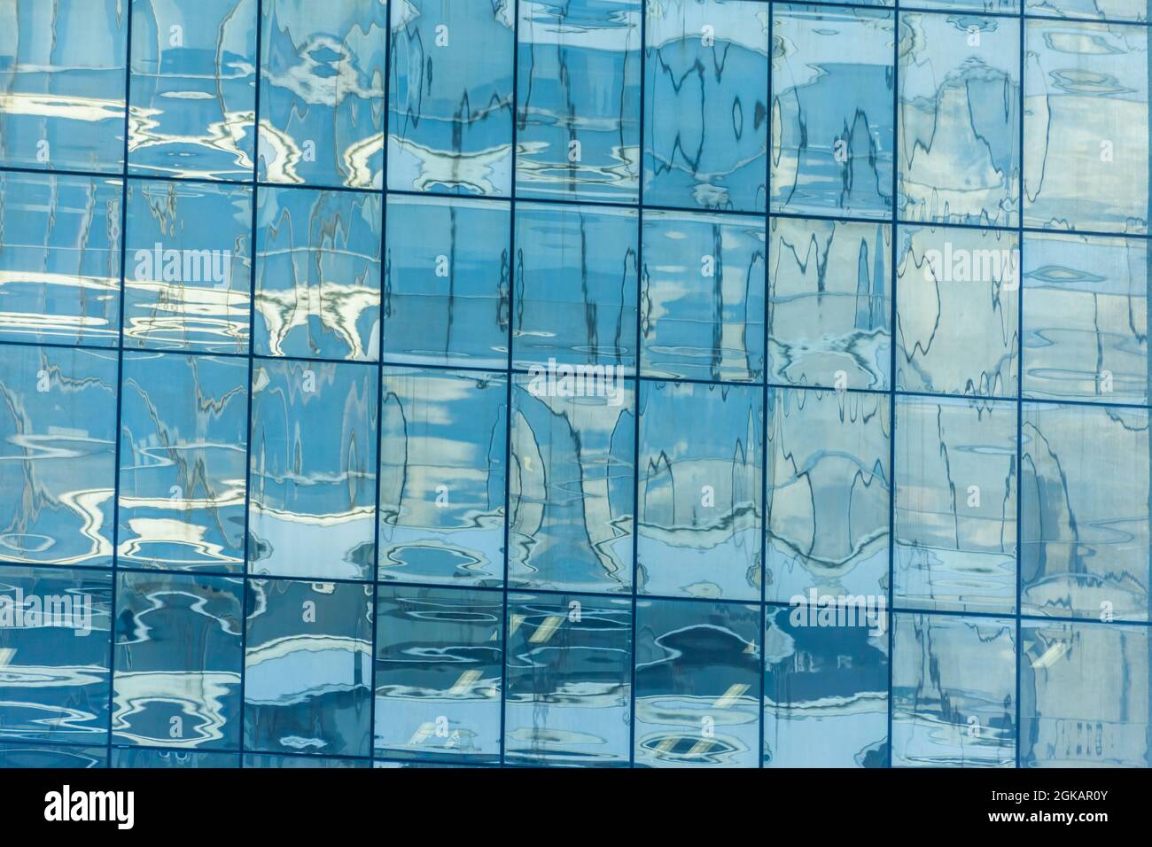 Modern office building with glass reflection background Stock Photo - Alamy