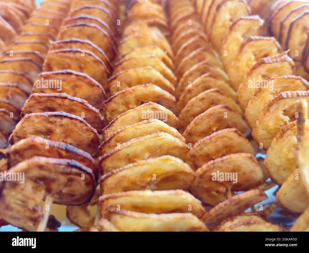 Round twisted potato fry with stick.Crispy Potato Fry Stock Photo - Alamy
