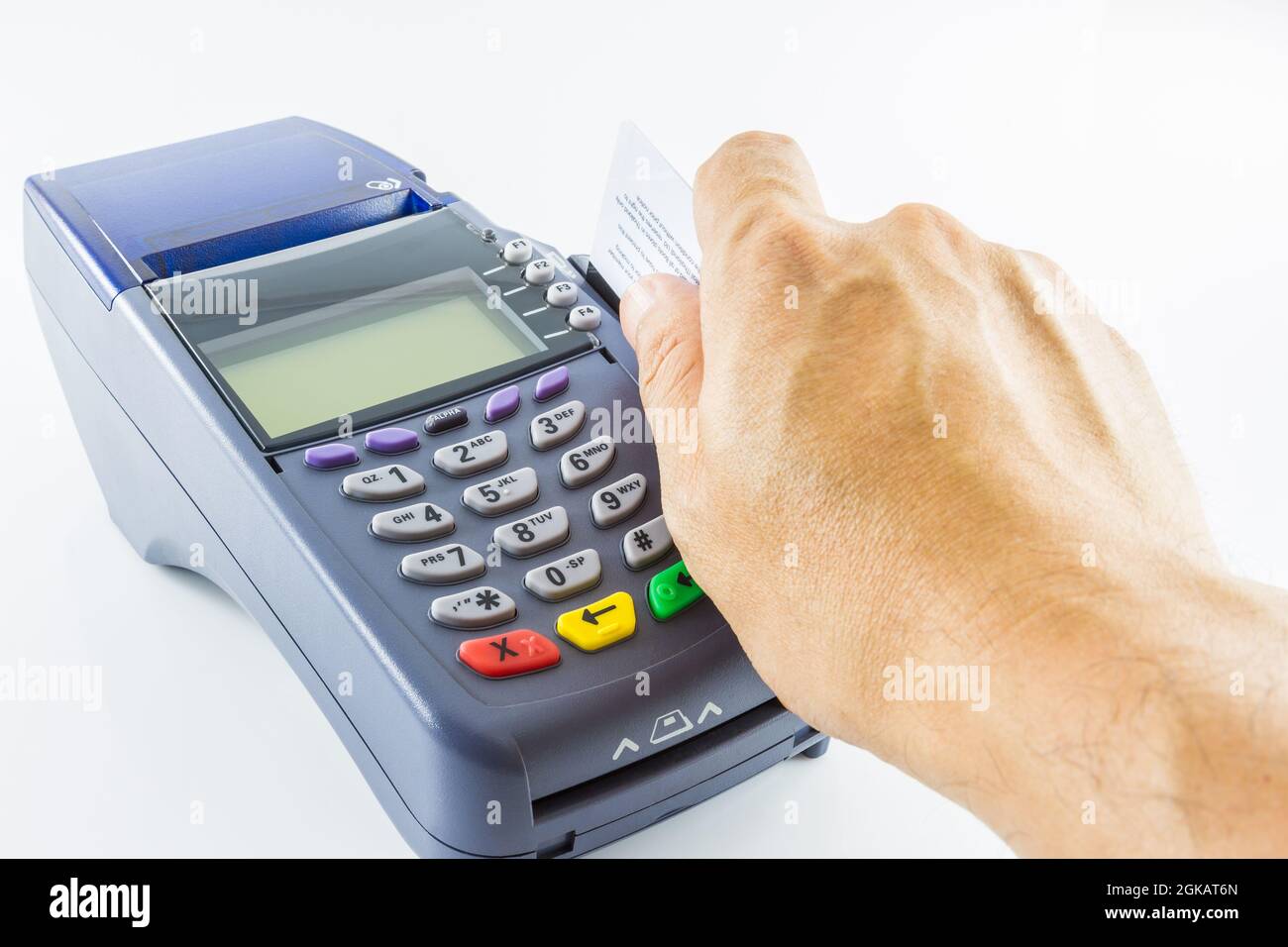 hand holding a credit card with credit card machine isolated on white ...