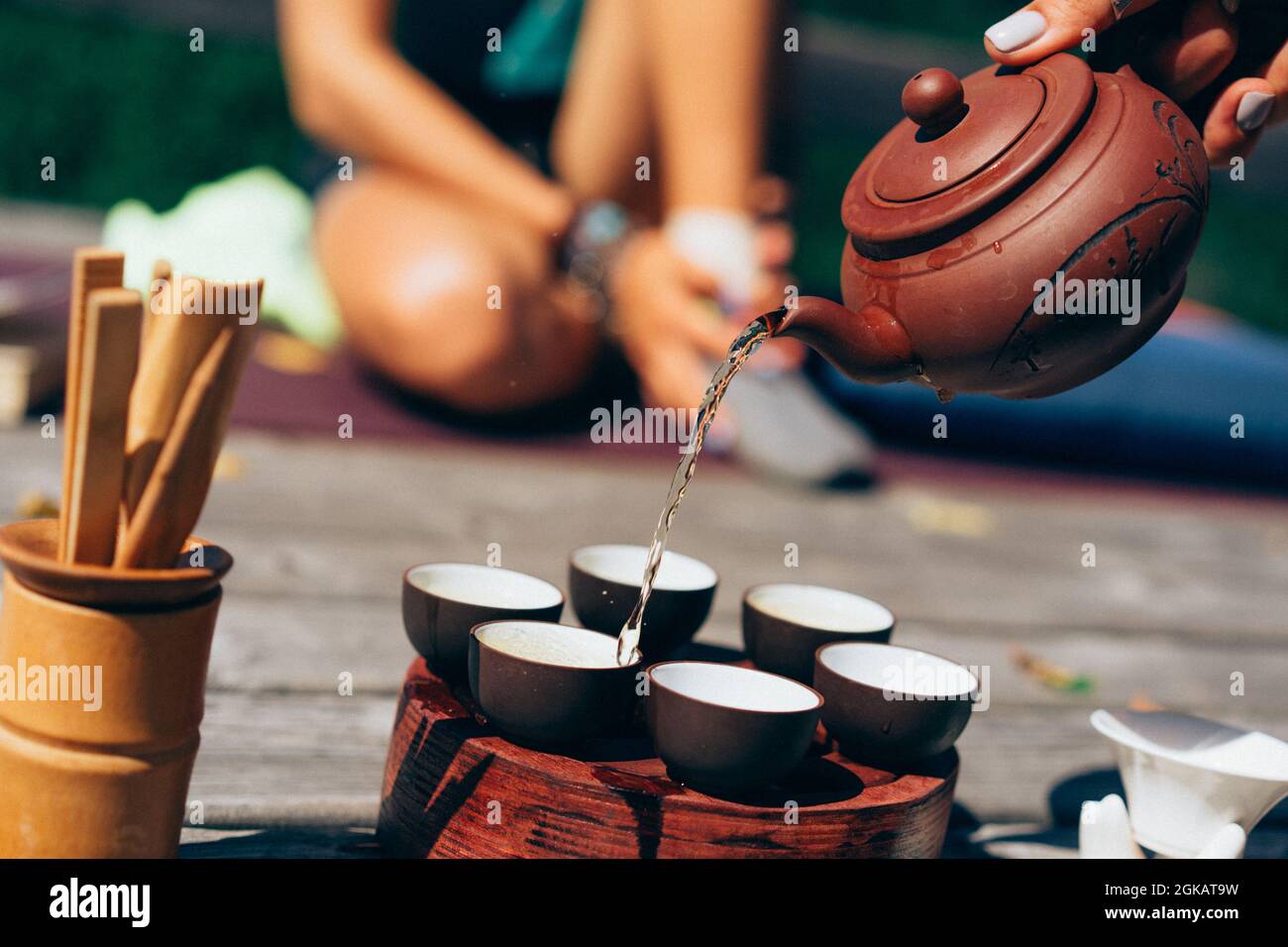 Tea ceremony, Woman pouring traditionally prepared tea Stock Photo - Alamy