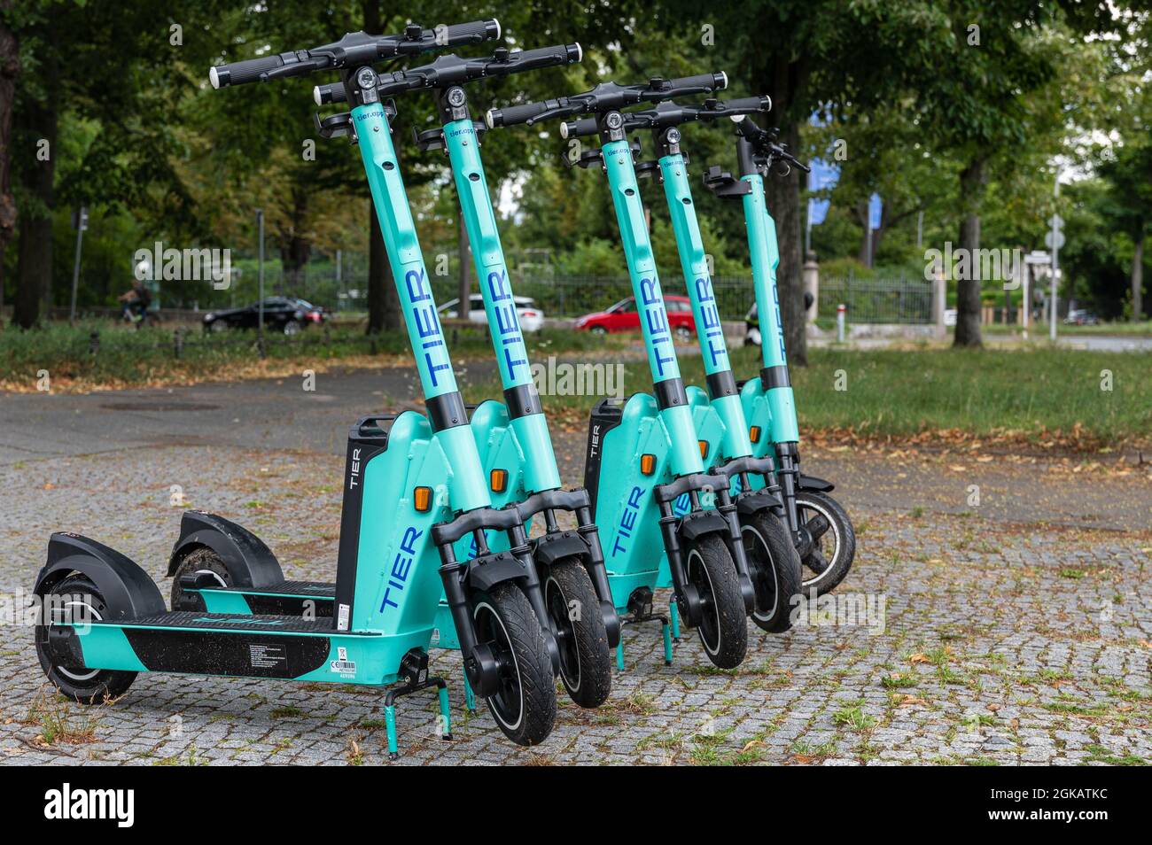 Row of five standing electric escooter or e-scooter of the company TIER ...