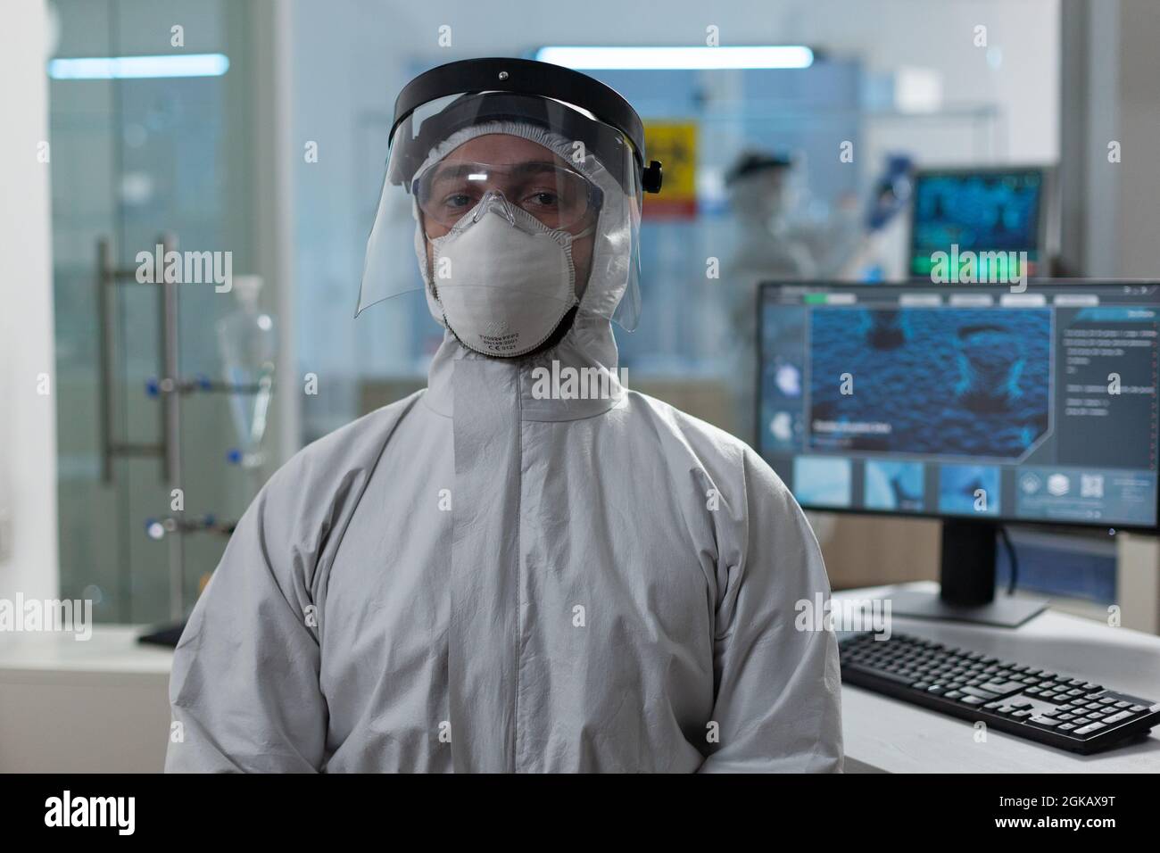 Portrait of biologist researcher in coronavirus protective medical ...