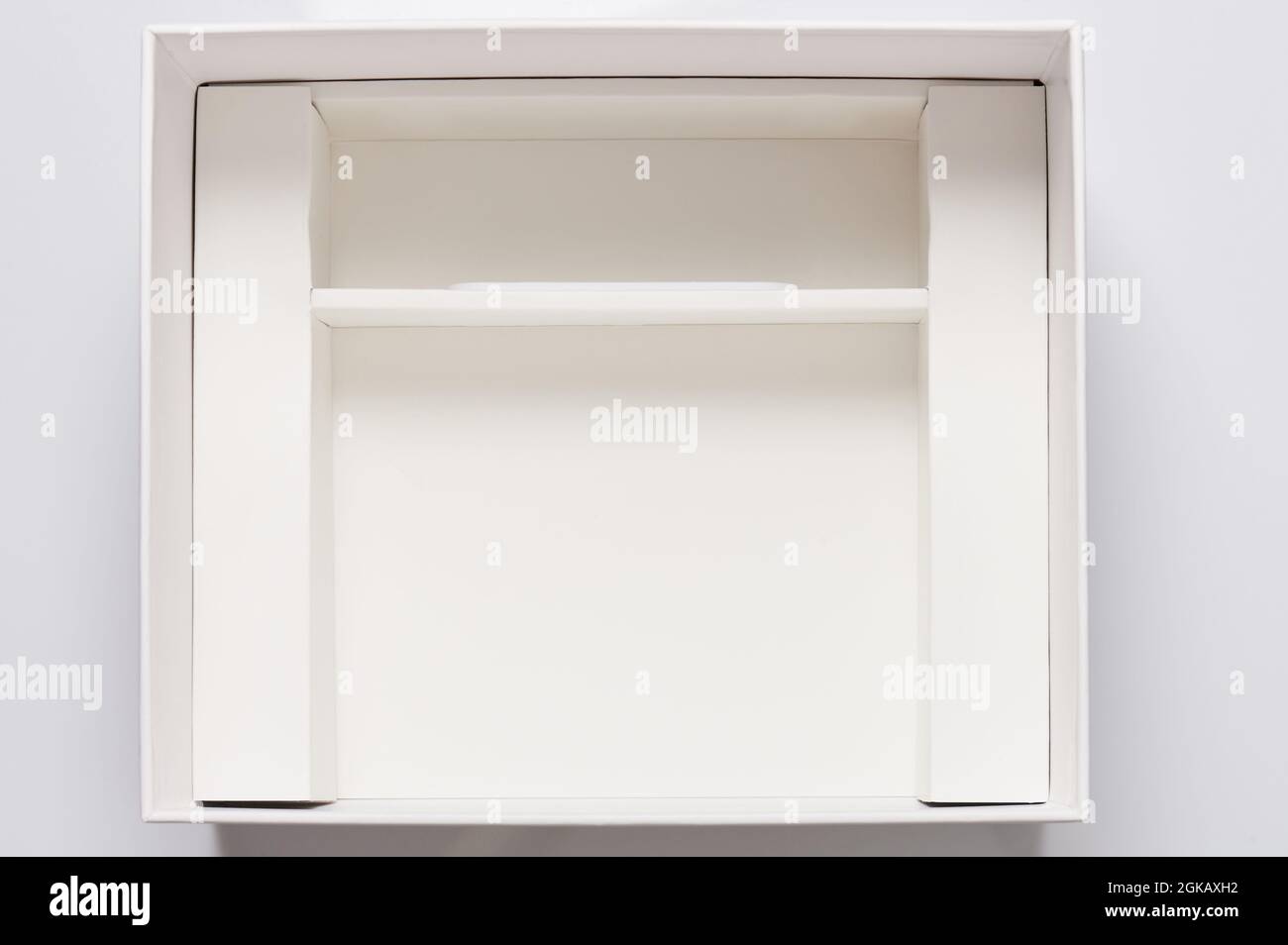 Open white box with compartment isolated above top view Stock Photo - Alamy