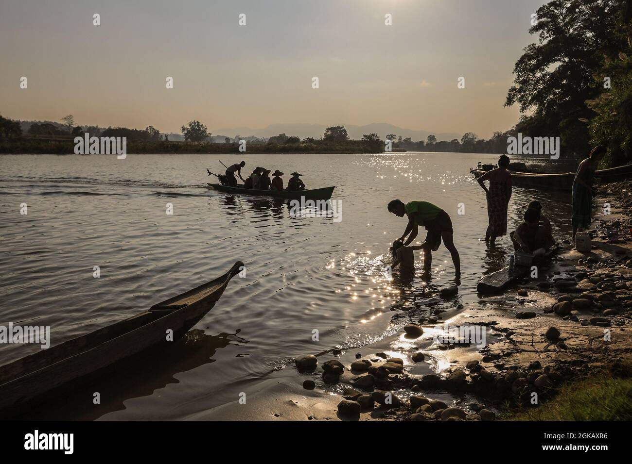 Village community using river as resource Stock Photo - Alamy