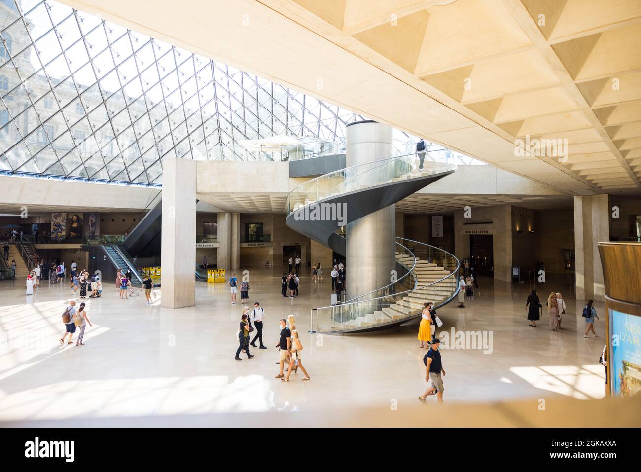 PARIS, FRANCE - Aug 16, 2021: The people in masks inside of the Louvre ...