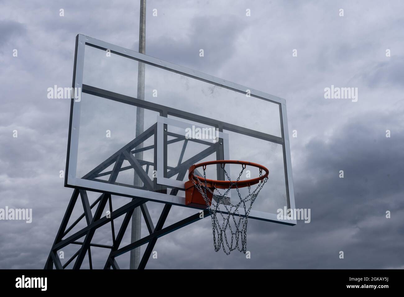 Basketball backboard with a ring, color photo processing. Black and ...