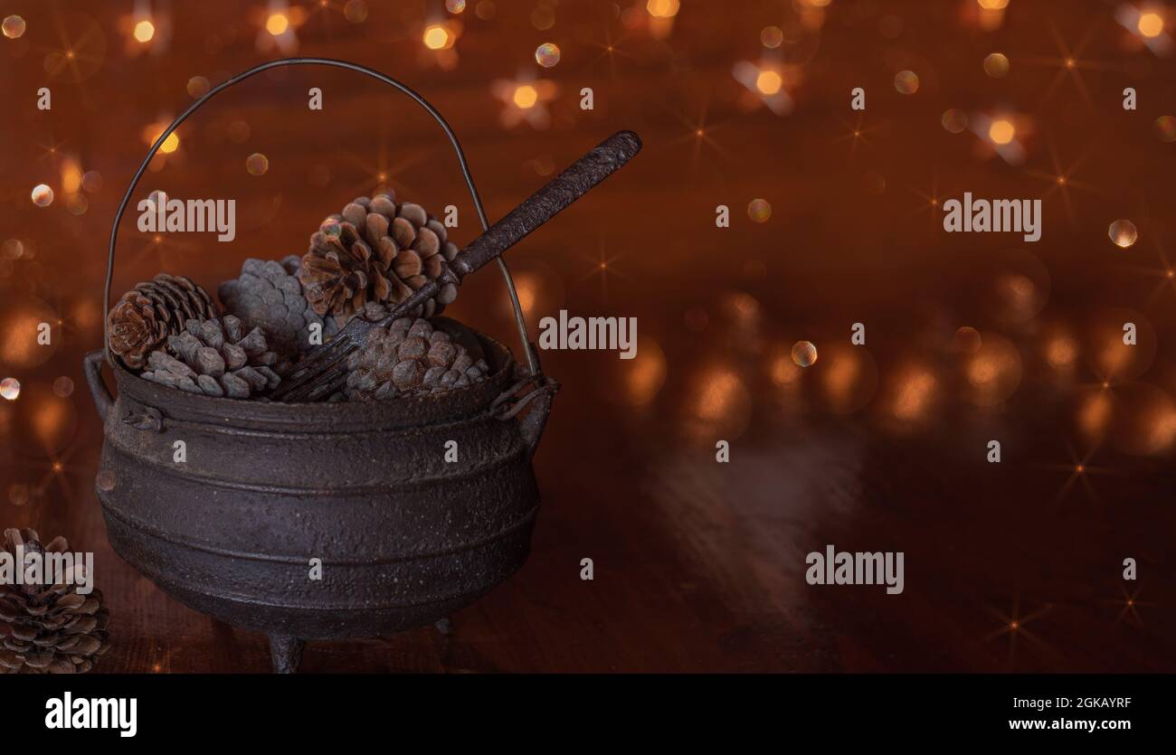 Vintage metal kettle with pine cones.w Winter time view for christmas ...