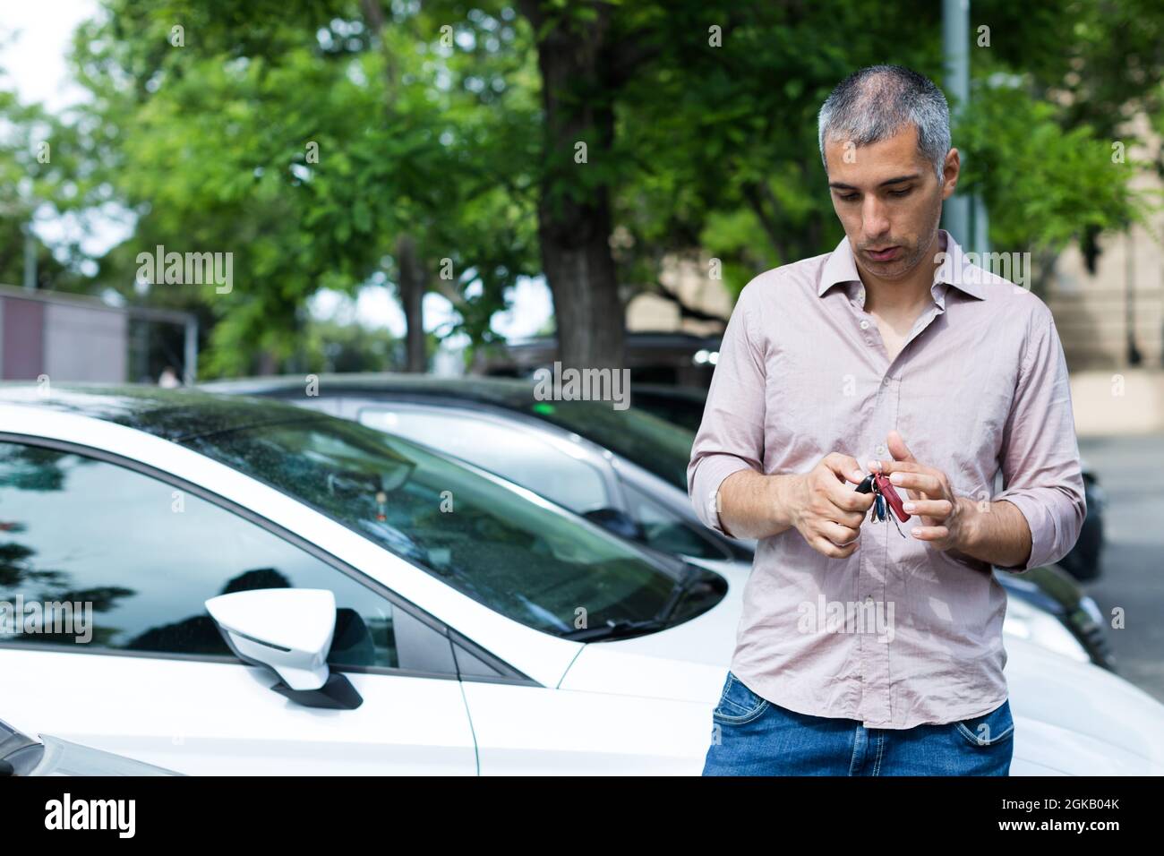 Portrait of man who is standing near his car Stock Photo - Alamy