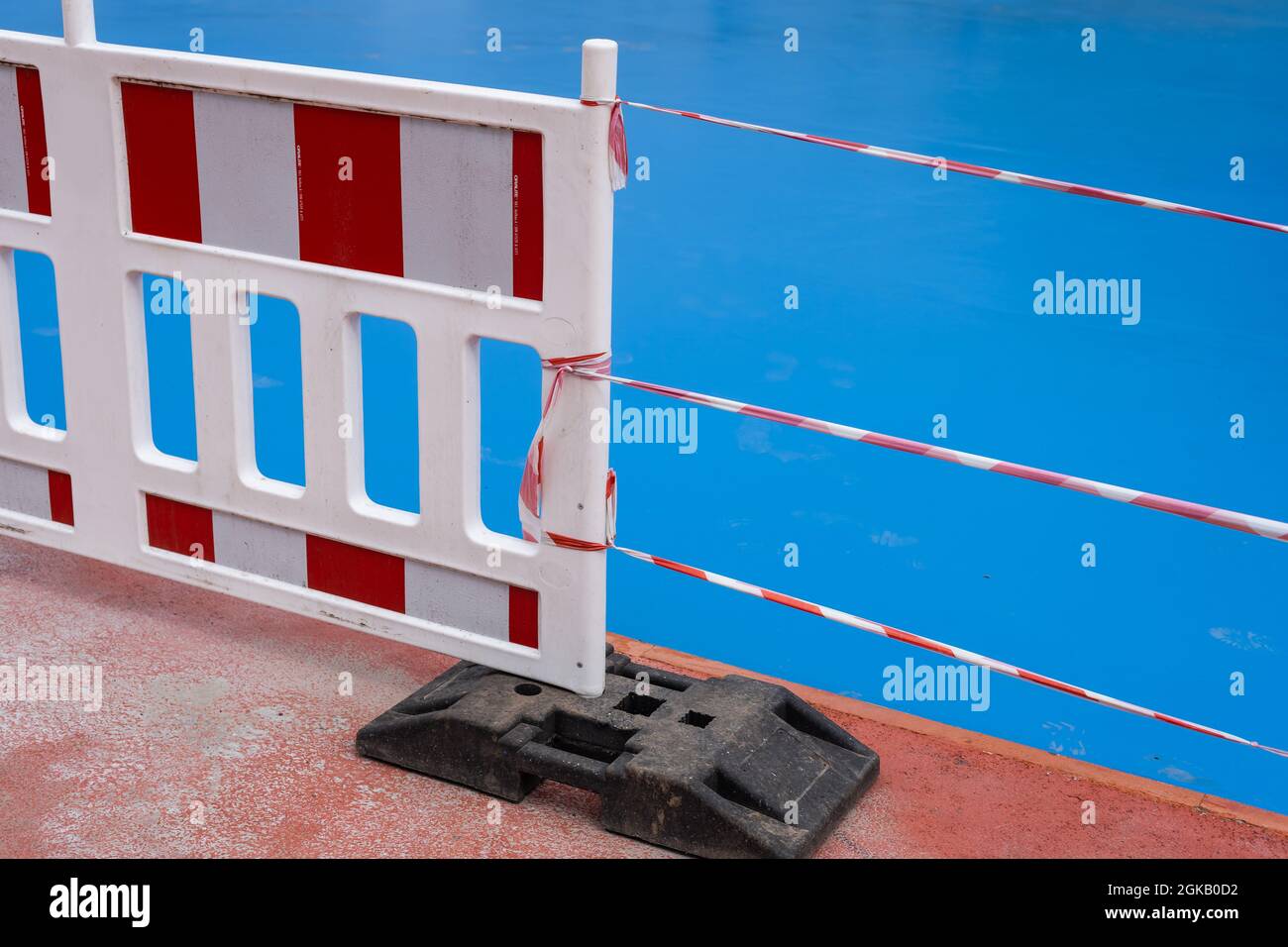 white barrier with red stripes on the background of stadium Stock Photo ...