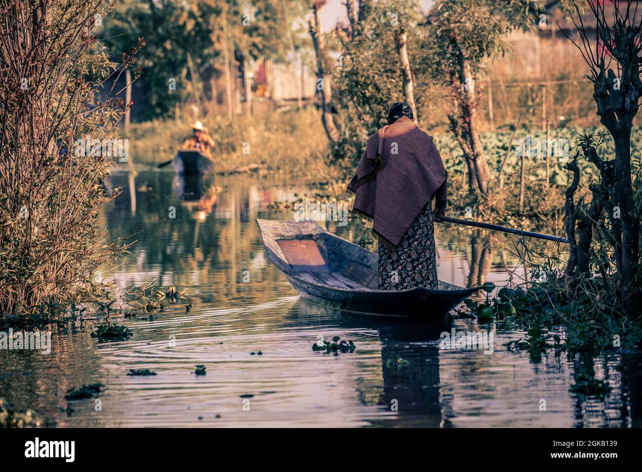 Old Lady rowing boat on Inle Lake Myanmar Stock Photo - Alamy