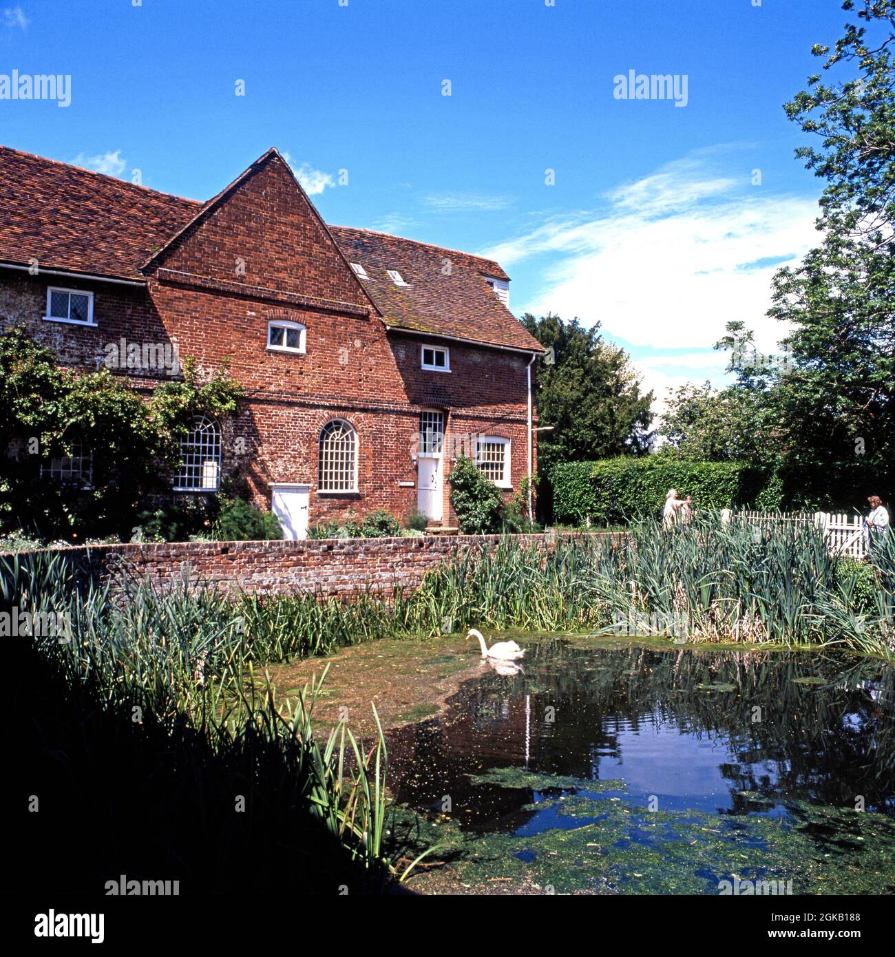 View of Flatford Mill with a swan in the foreground on the River Stour ...