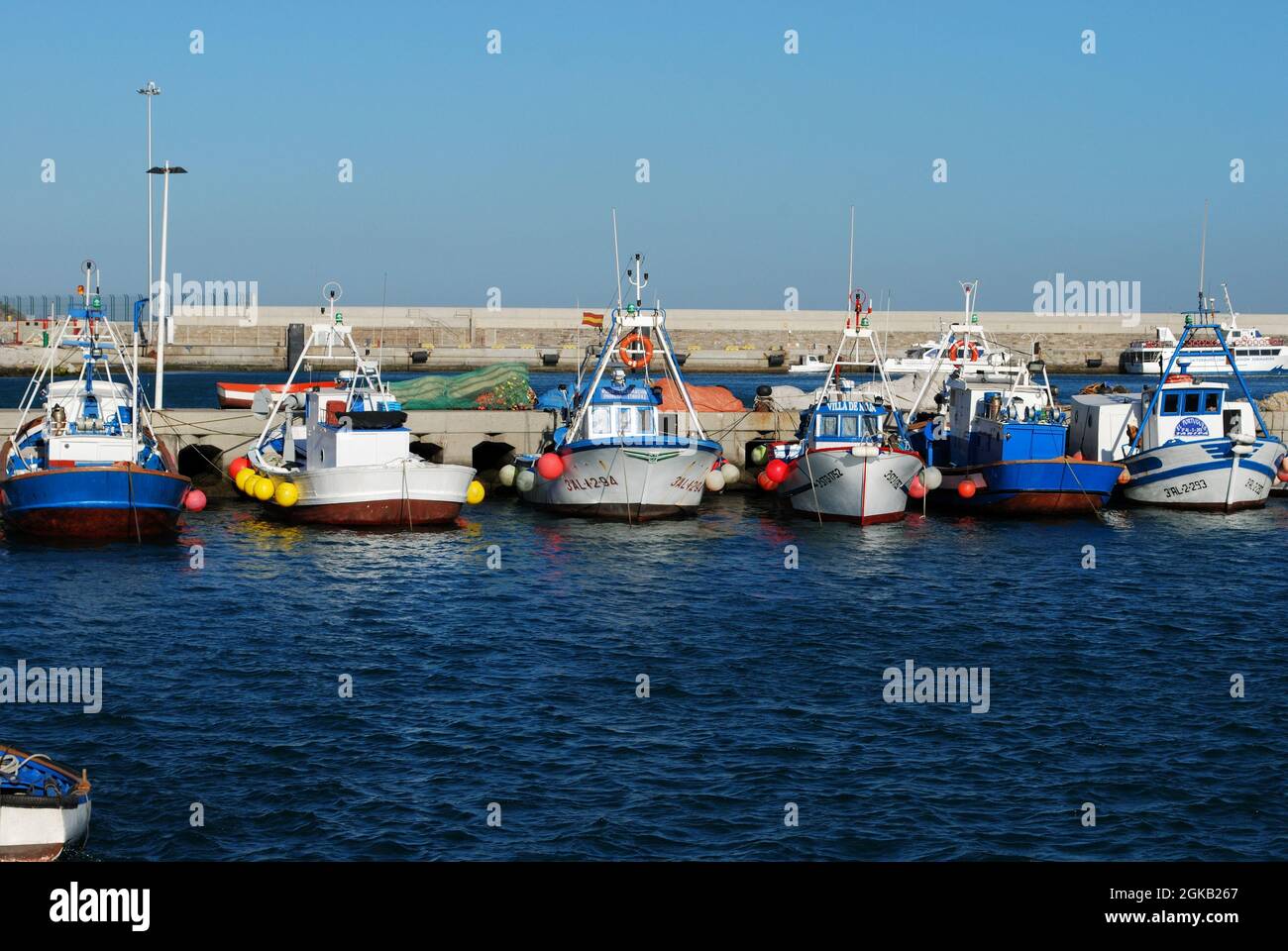 View of traditional Spanish fishing trawlers in the harbour, Tarifa ...