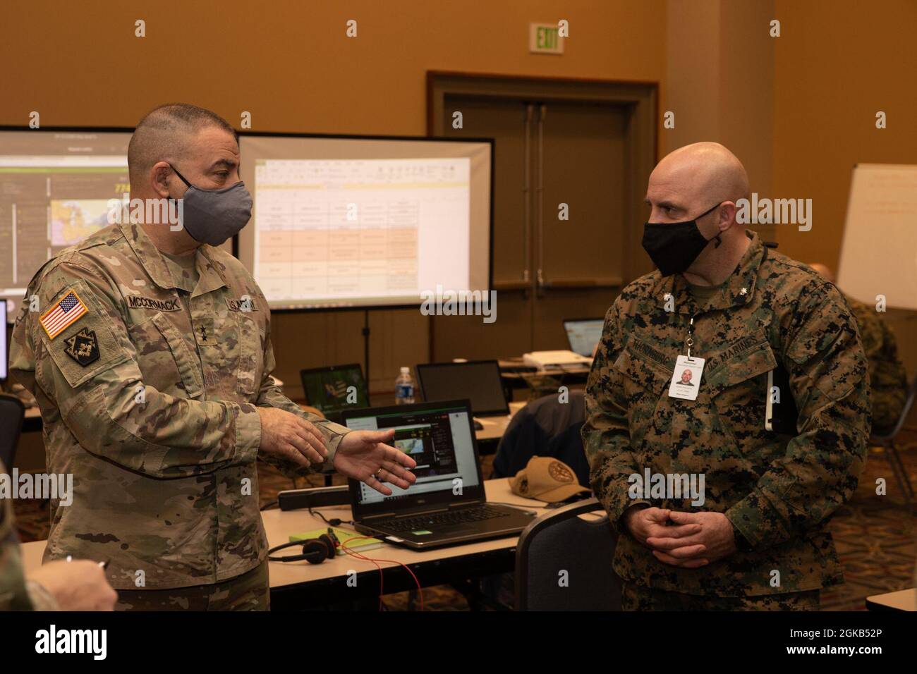 U.S. Army Maj. Gen. Mark McCormack, left, commanding general of the ...