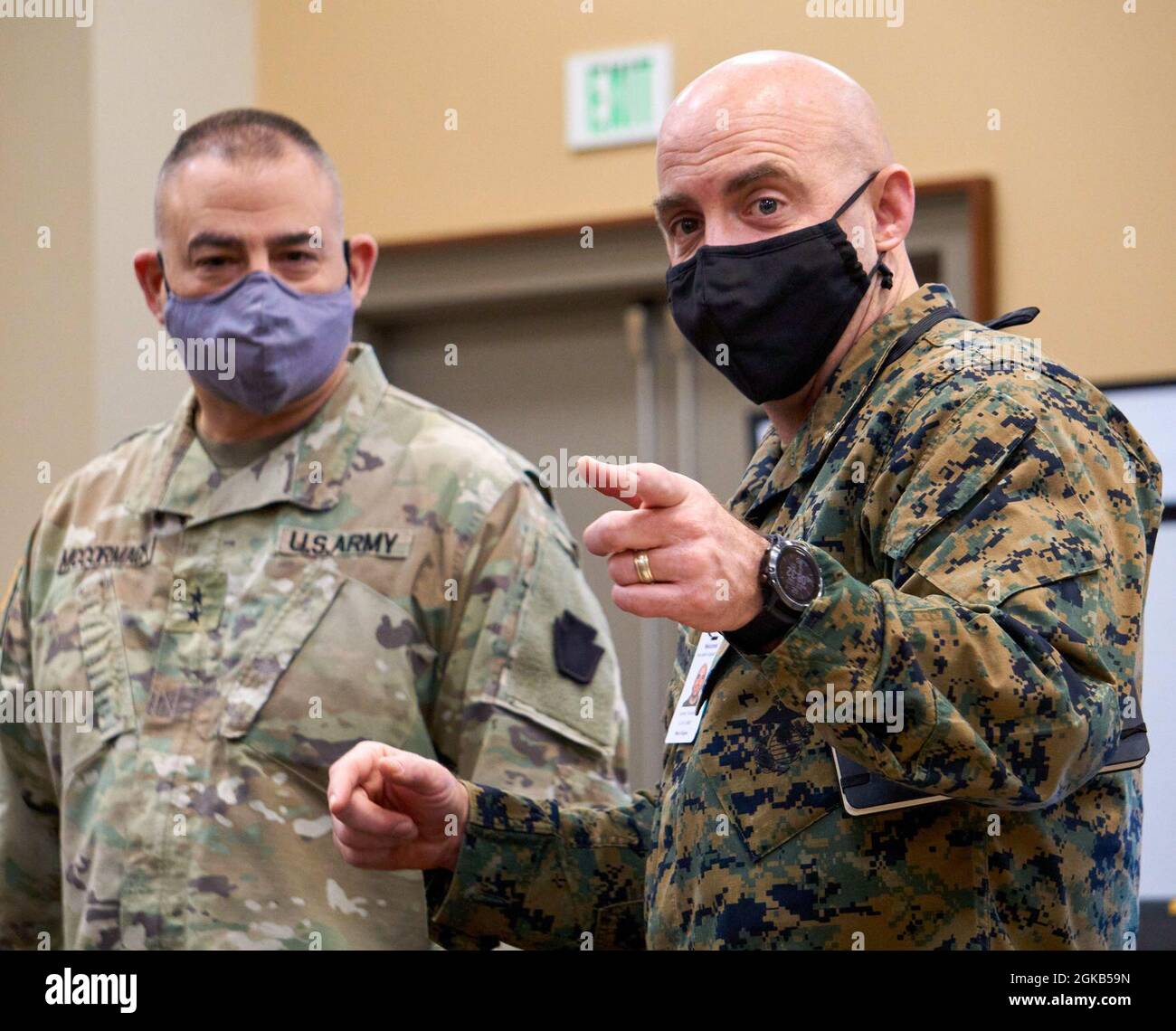 U.S. Army Maj. Gen. Mark McCormack, left, commanding general of the ...