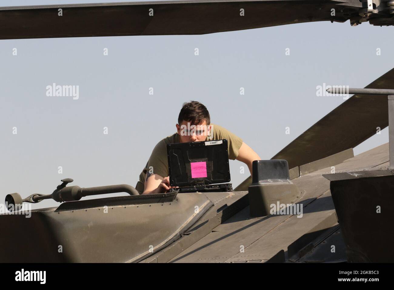 U.S. Army Pfc. Hunter Escue, AH-64 helicopter maintainer with Alpha ...