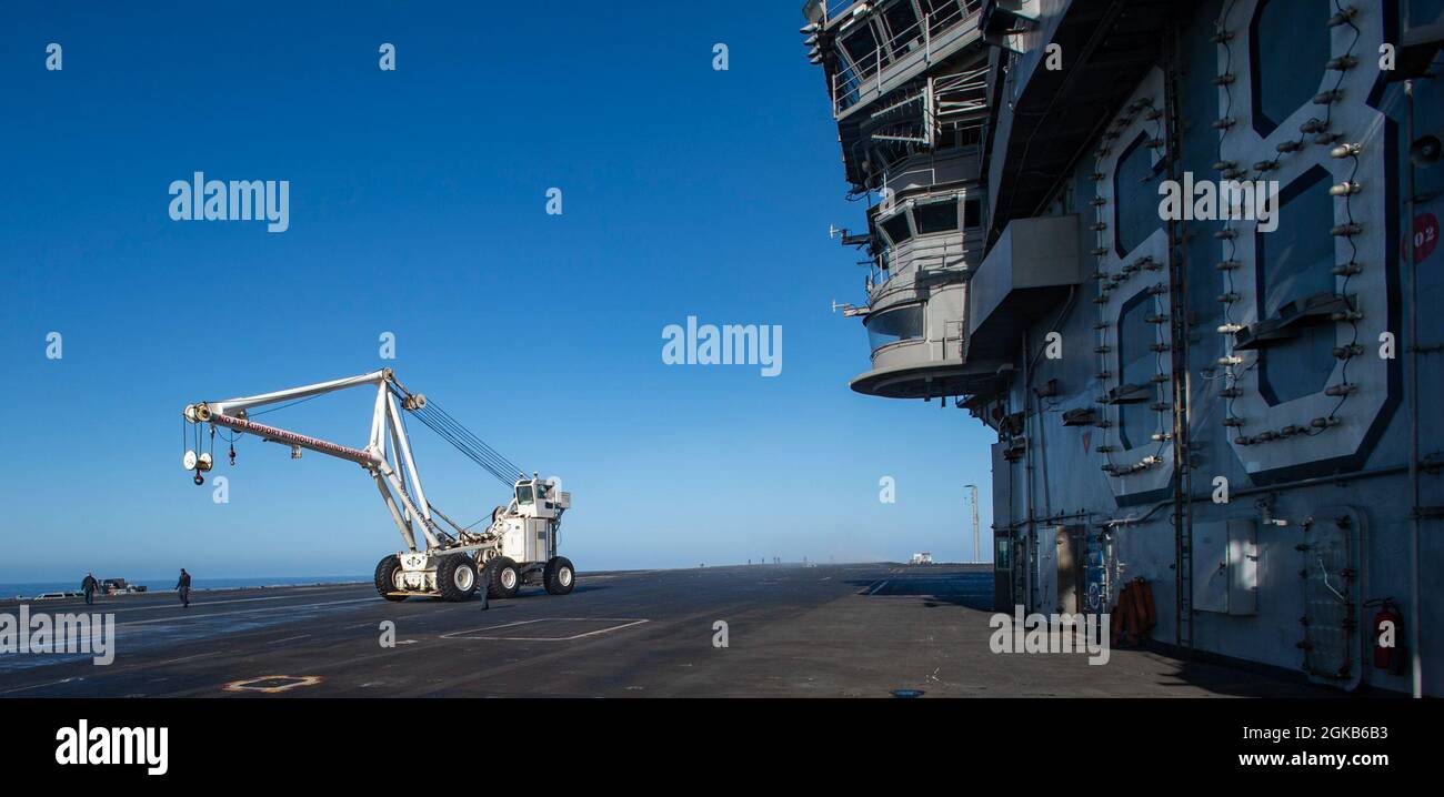 210301-N-EB640-1004 PACIFIC OCEAN (Mar. 1, 2021) Sailors move a NS-60 ...