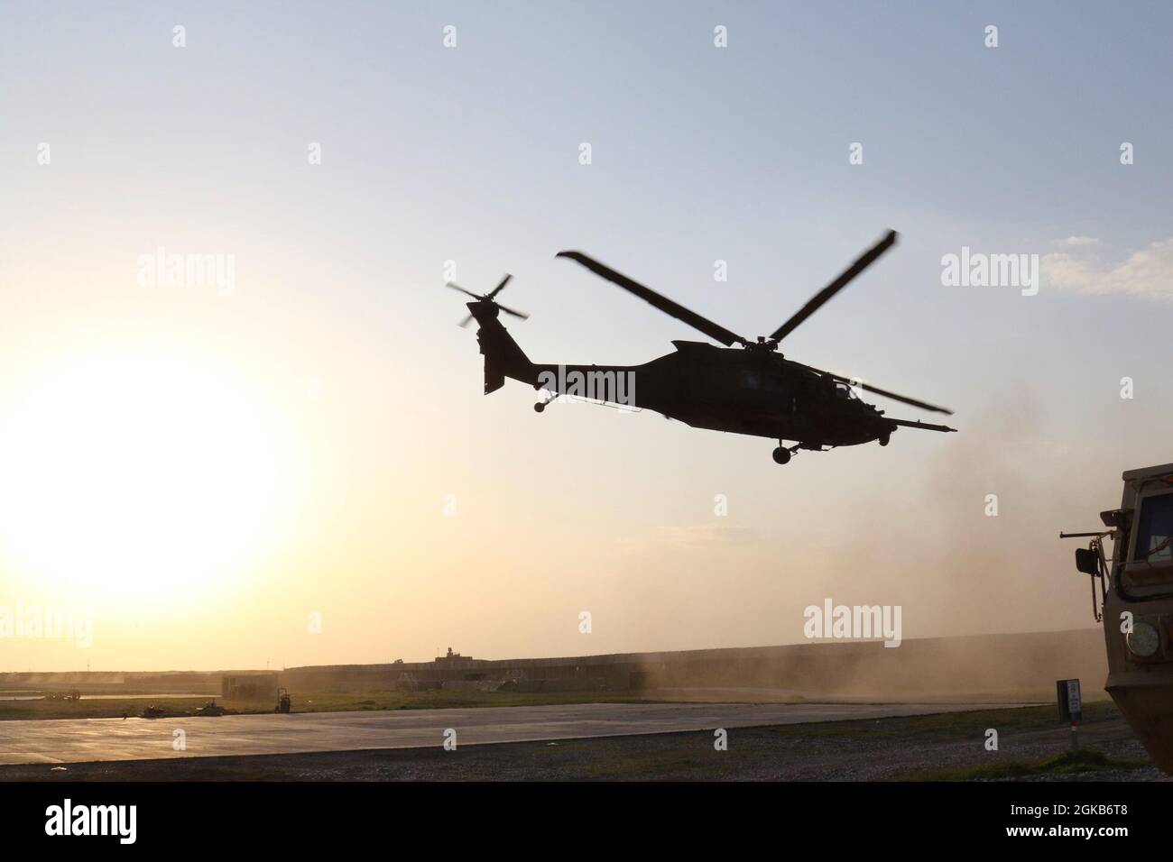 A UH-60 Black Hawk helicopter takes off from a forward arming and ...