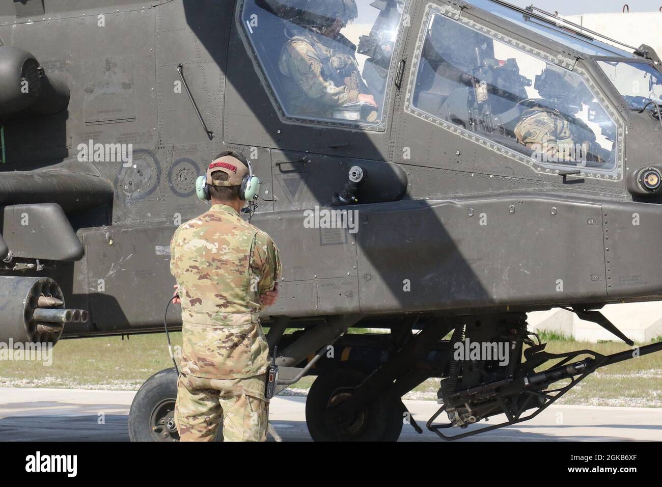 An AH-64 Apache helicopter crew, assigned to Alpha Company, 1-82nd ...