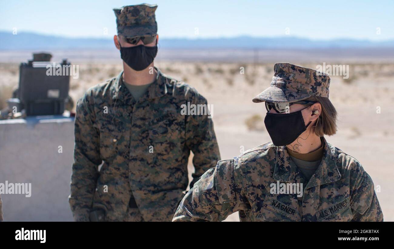 U.S. Marine Corps LtCol. Kathryn Wagner, right, commanding officer of ...