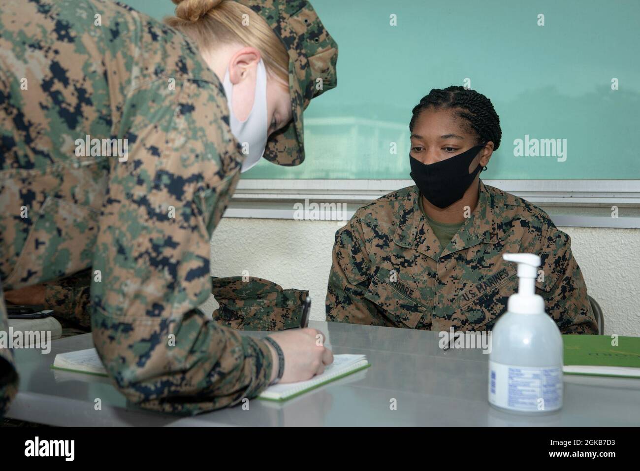 A U.S. Navy Corpsman observes a U.S. Marine with Marine Rotational ...