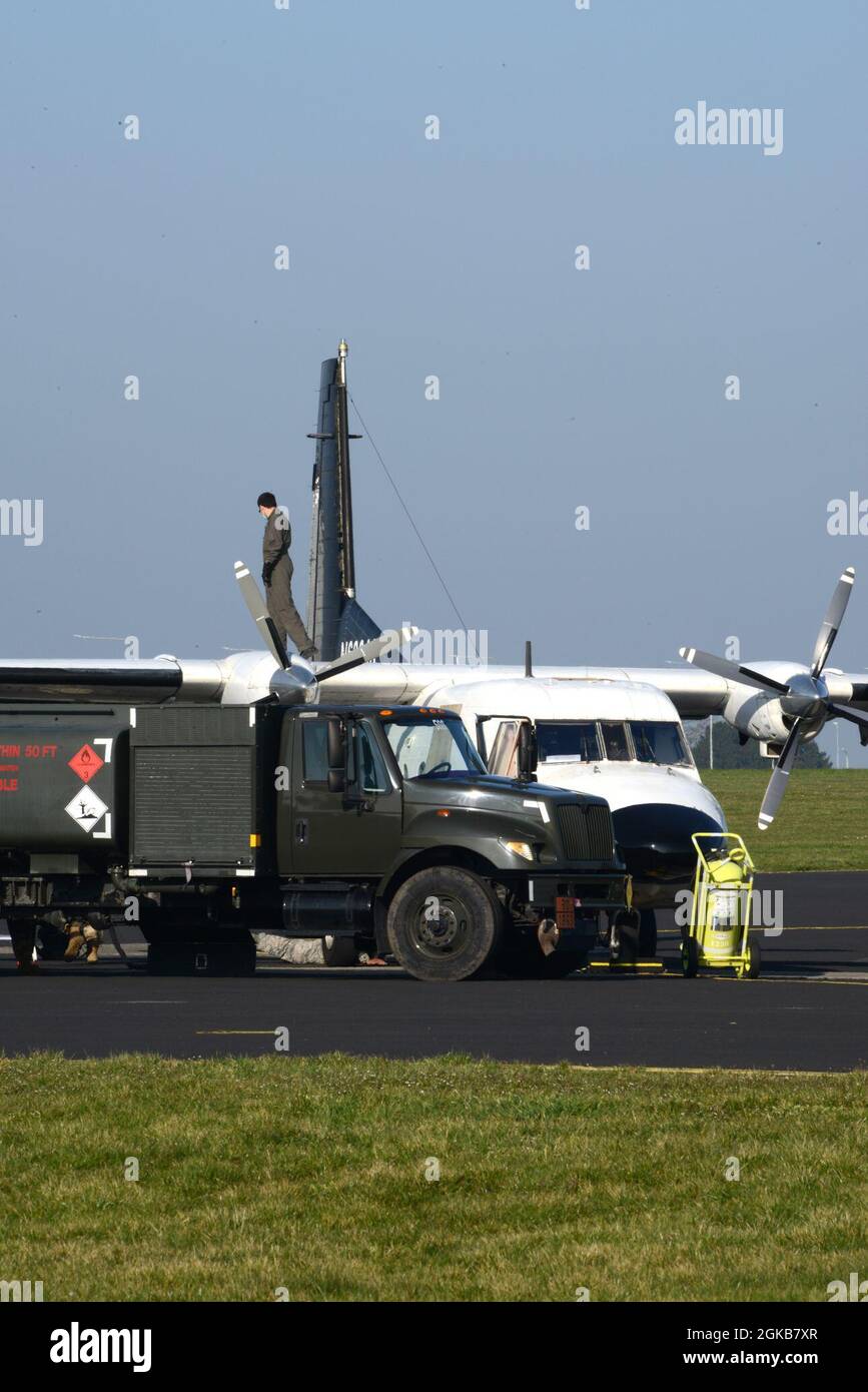 U.S. Airmen, assigned to the 424th Air Base Squadron, refuel the ...