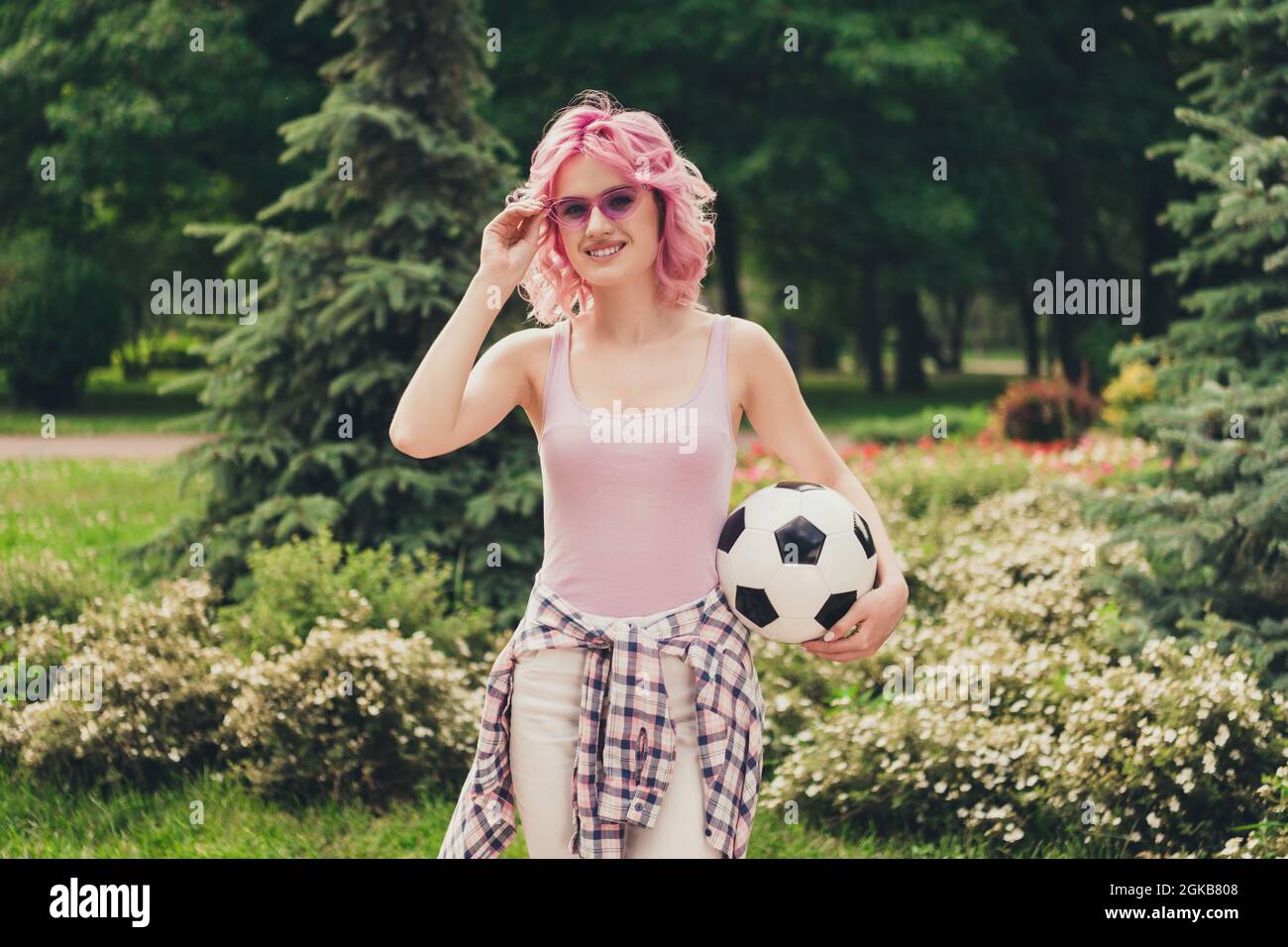 Photo of young sportive girl happy positive smile hold soccer ball ...