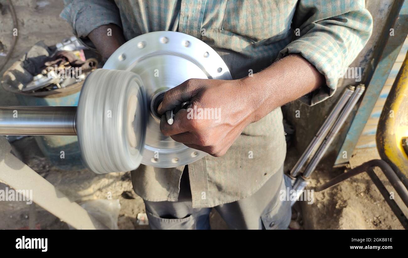 Bike wheel Brake Drum, polishing concept. Professional male auto ...
