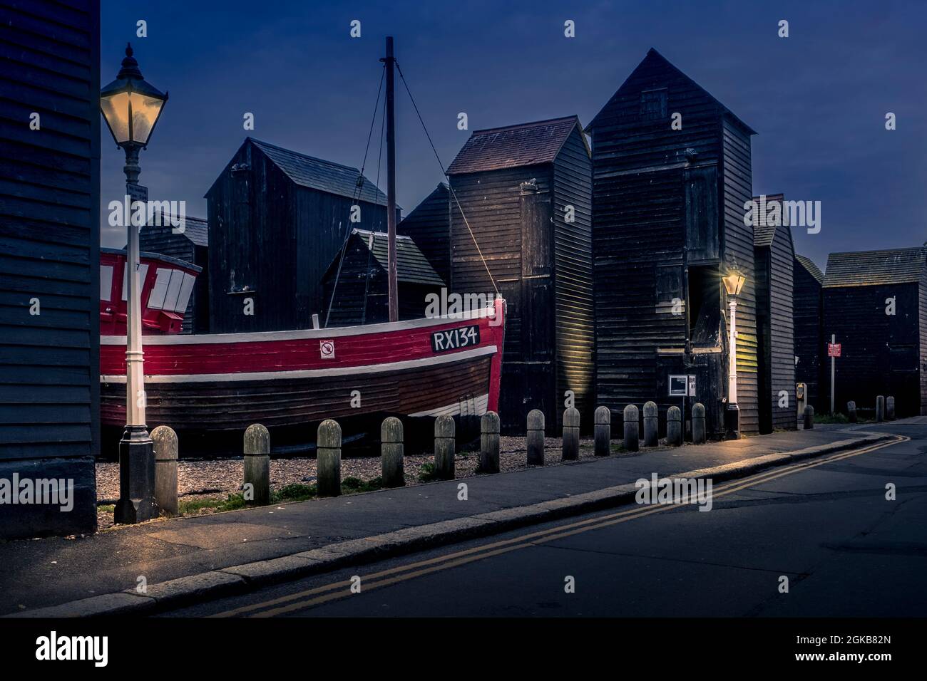 An old fishing boat and the Net Shops in Hastings old town Stock Photo ...