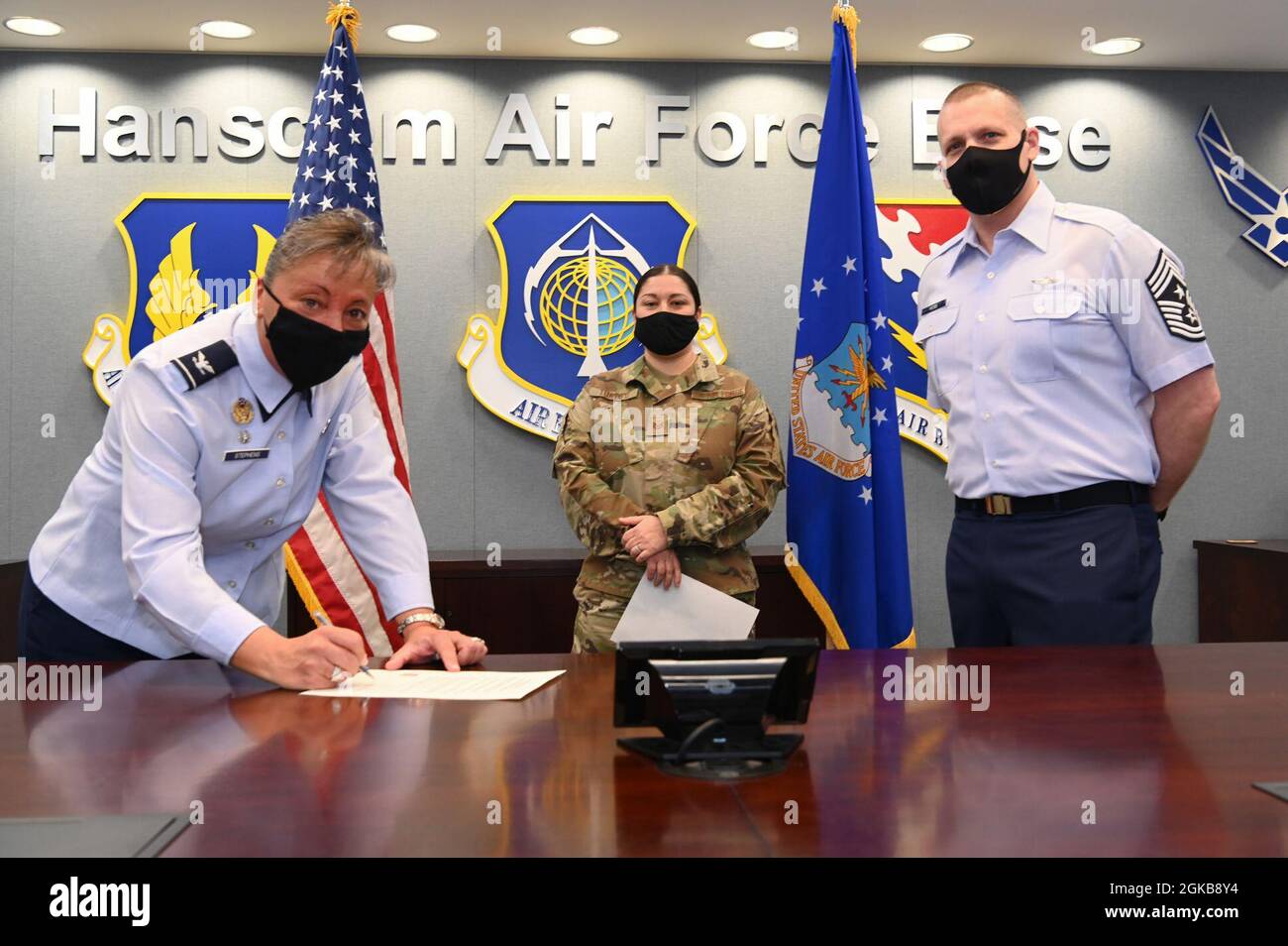 Col. Katrina Stephens, left, installation commander, signs a Women’s ...