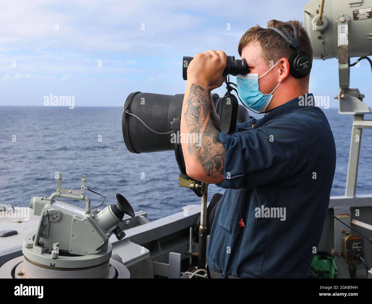 Boatswain's Mate Seaman Jason Farris, from Sparta, Tenn., stands watch ...