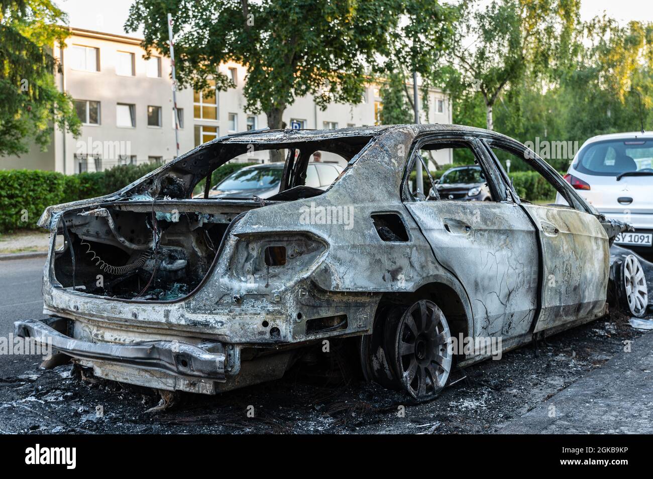 Burnt out Mercedes in the residential area by the roadside Stock Photo ...
