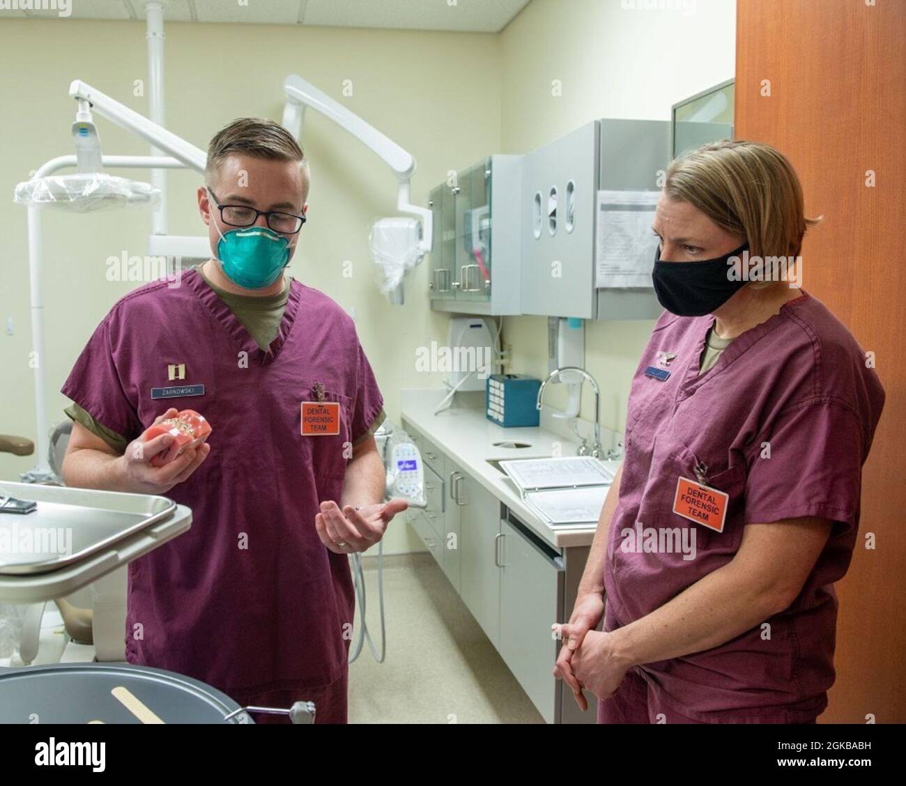 U.S. Air Force Capt. Ryan Zarnowski, left, a general dentist assigned ...