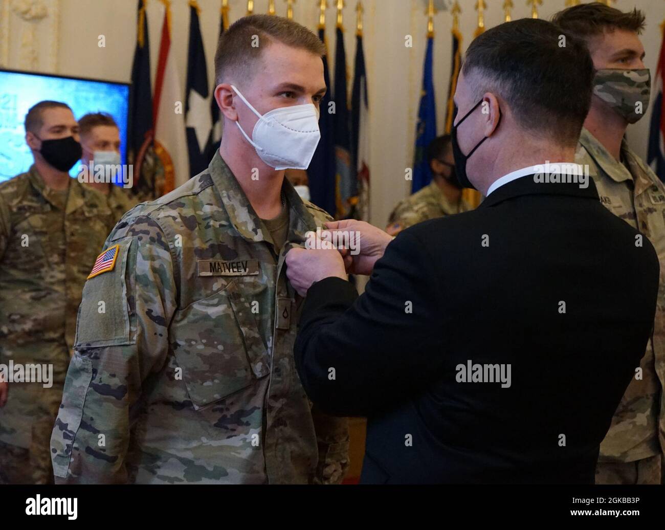 Pfc. Samuil Matveev, USAG Rheinland Pfalz, is presented the Army ...