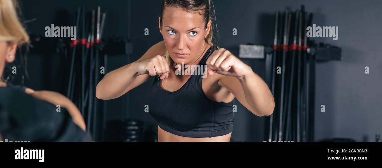 Woman training hard boxing in the gym Stock Photo - Alamy