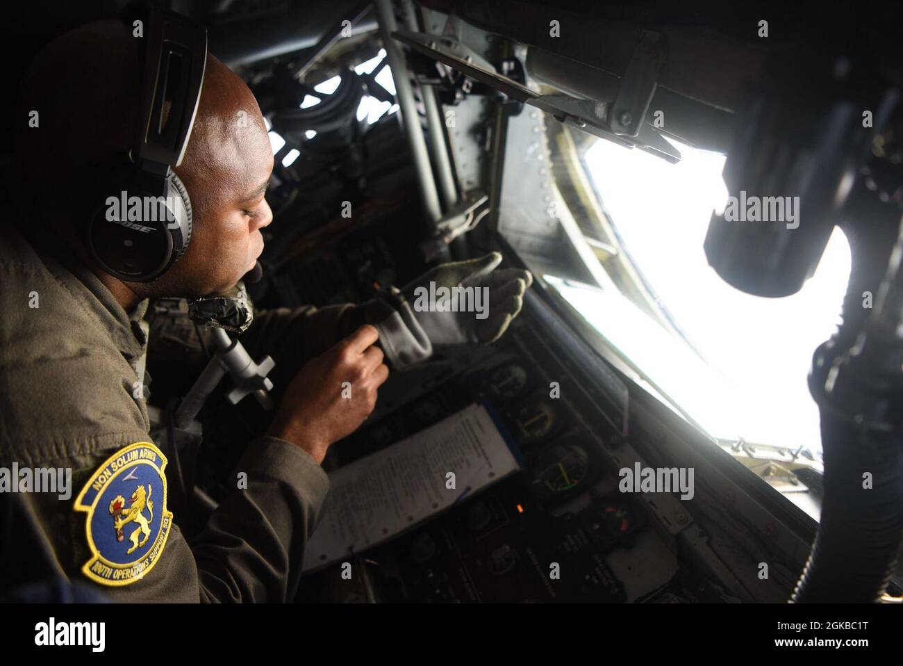 U.S. Air Force Master Sgt. Mark Smith, 100th Operations Support Squadron boom operator, puts on ...