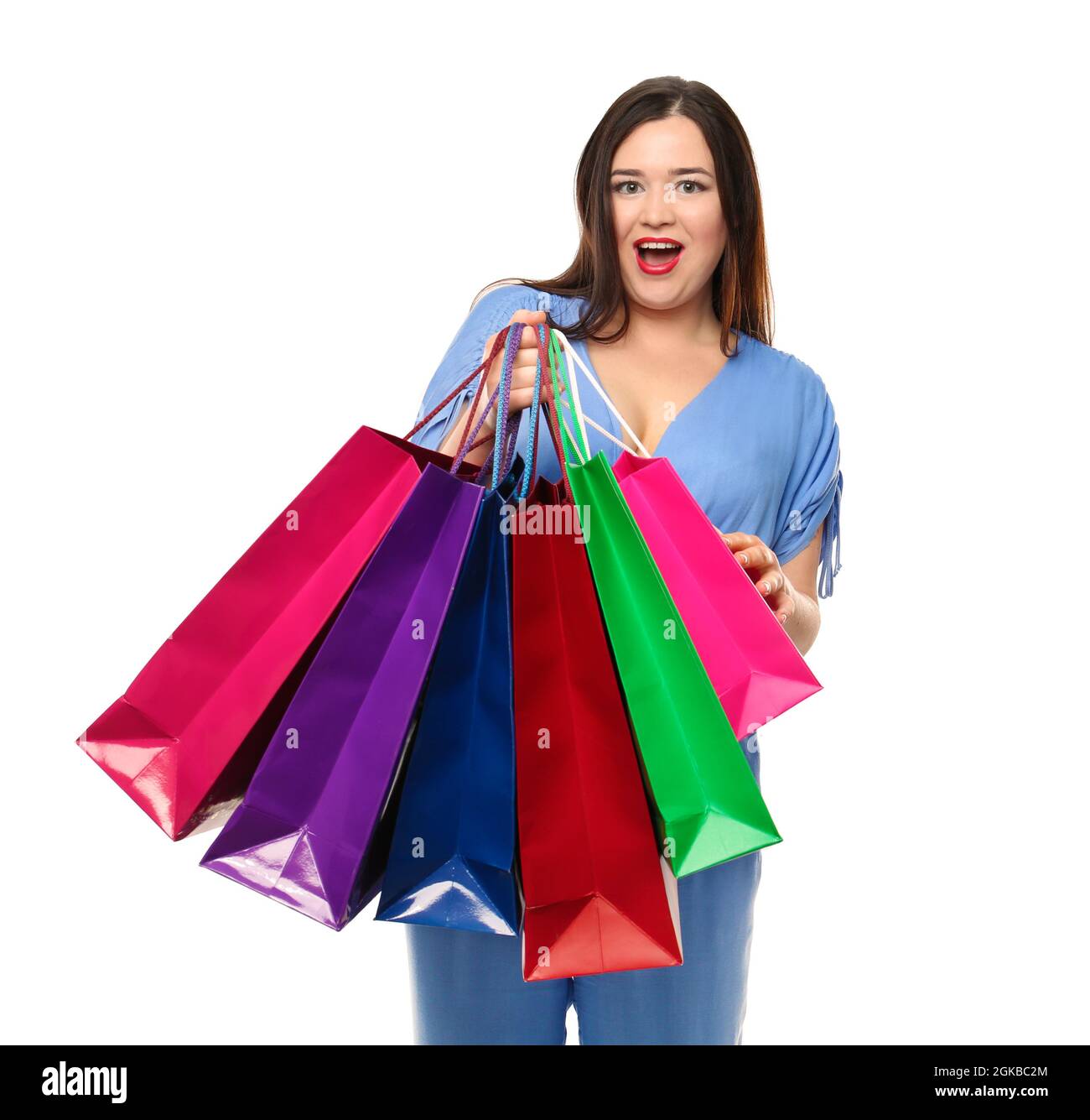 Beautiful stylish overweight woman with shopping bags on white ...